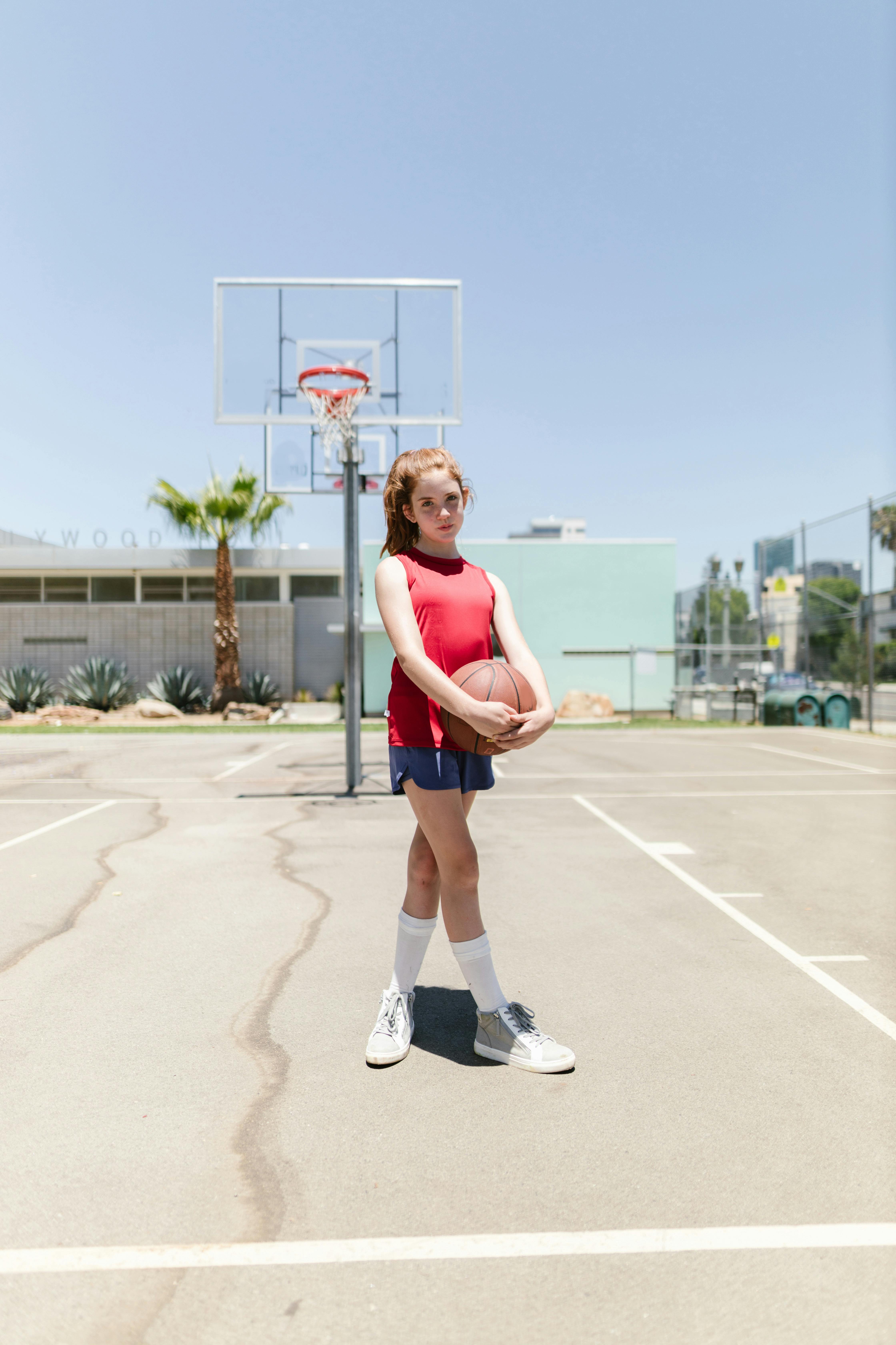 Girl holding Basketball · Free Stock Photo