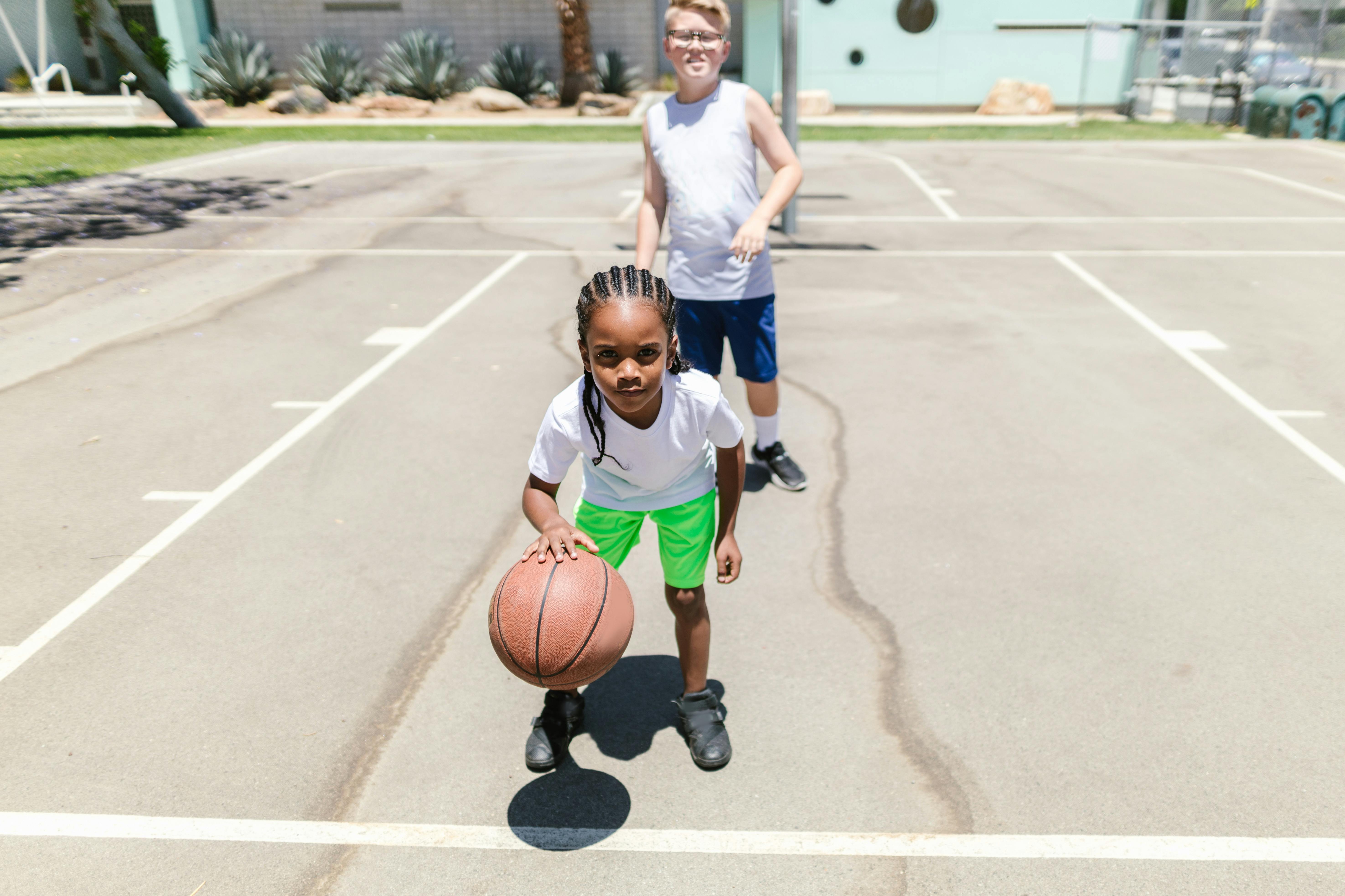 Boy Dribbling Basketball · Free Stock Photo