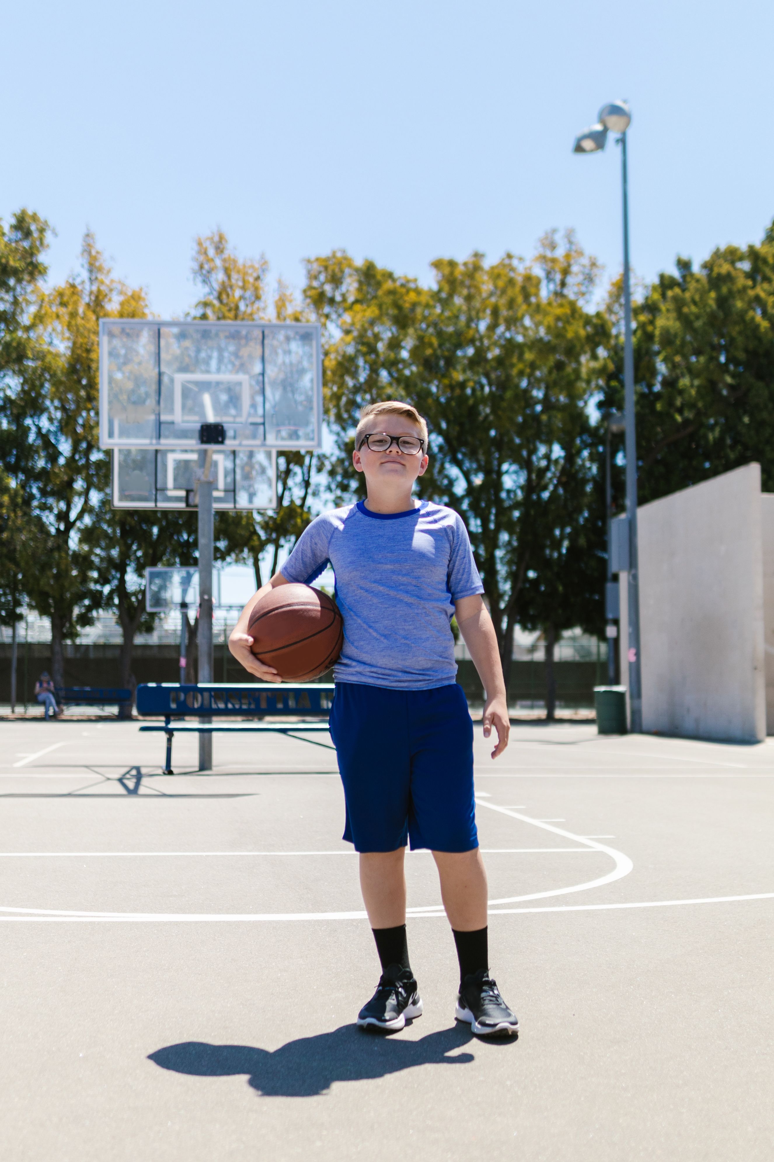 Kid holding a Baskteball · Free Stock Photo