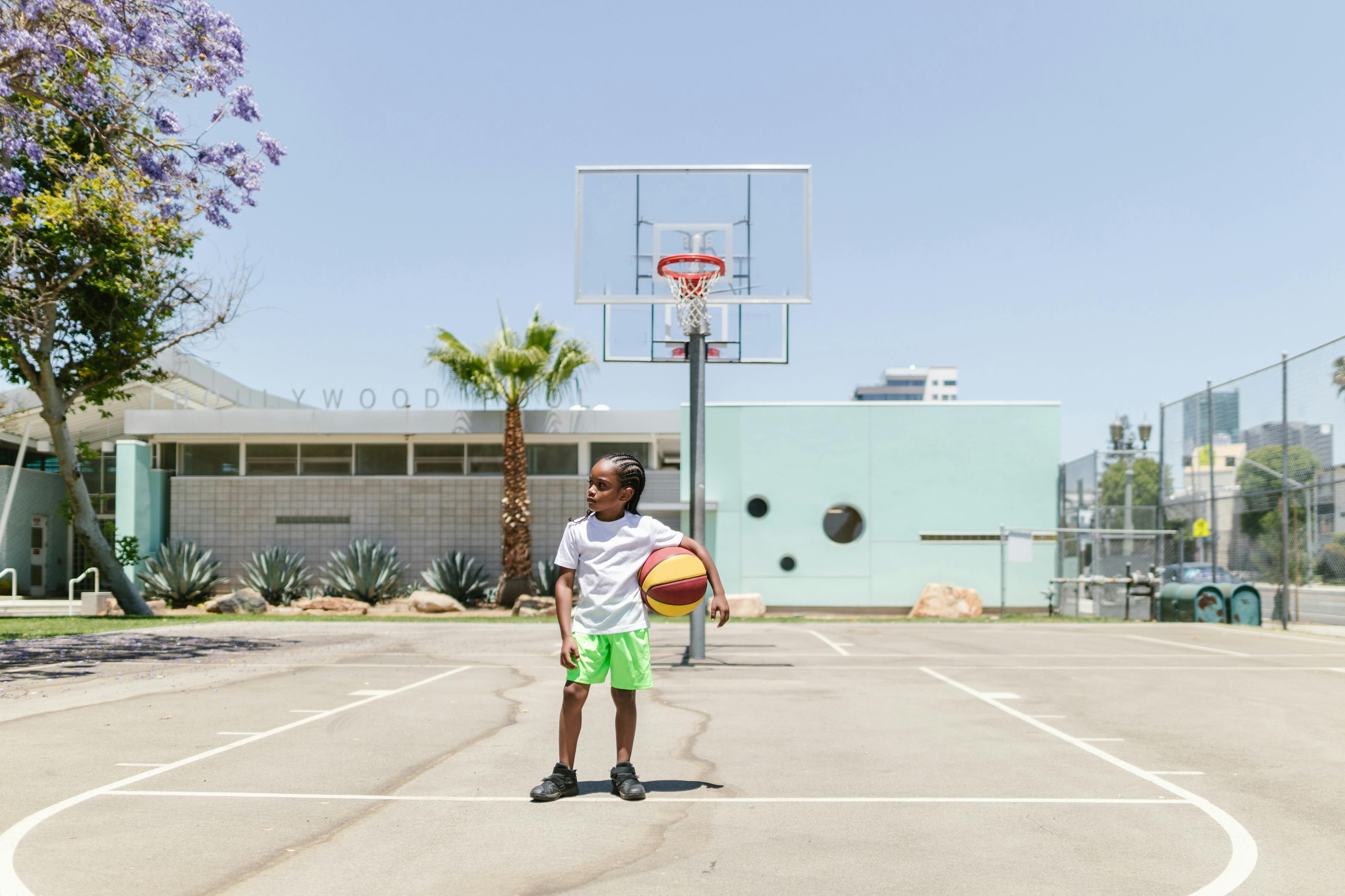 A Boy Playing Basketball Alone · Free Stock Photo