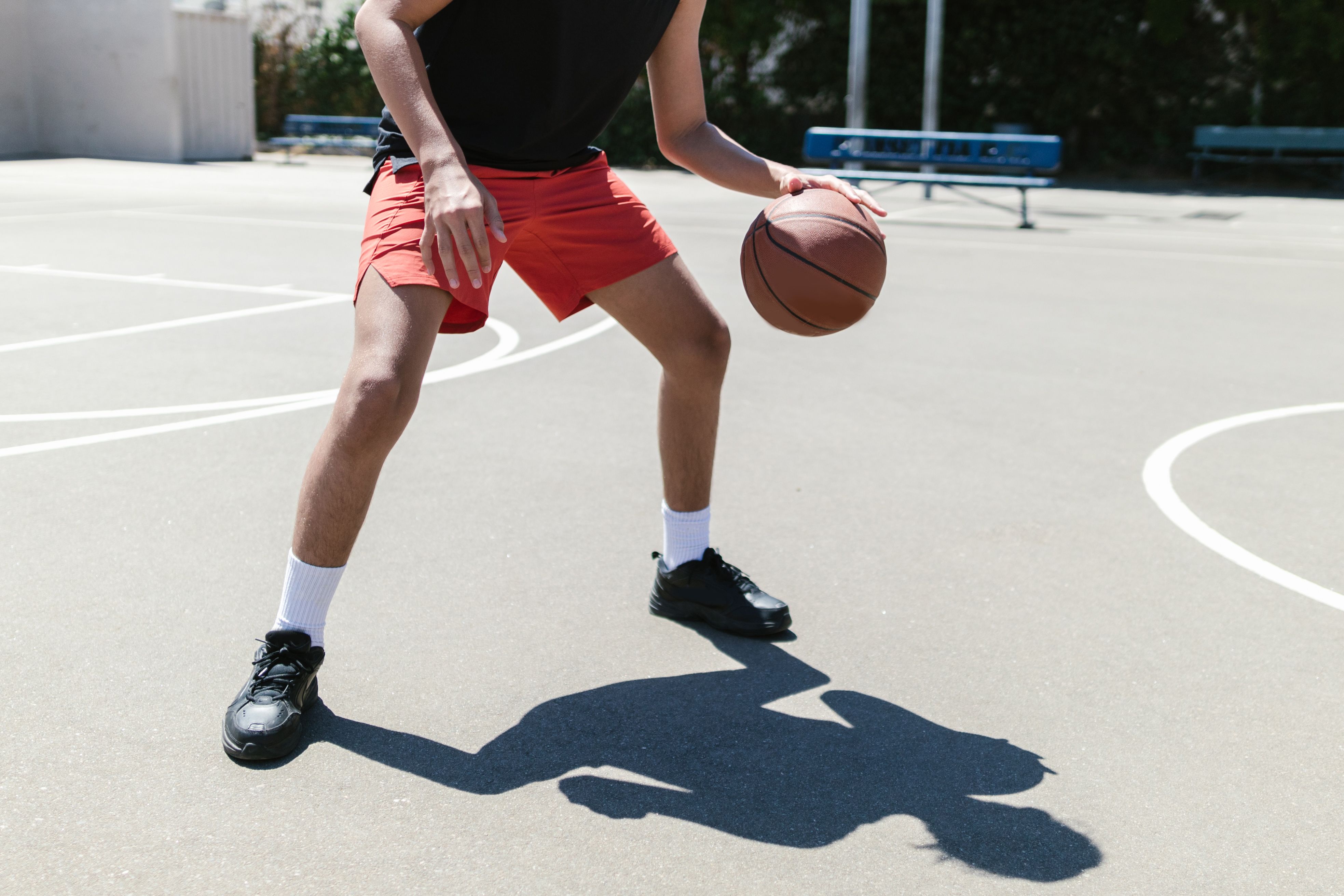 A Basketball on the Court Pavement · Free Stock Photo
