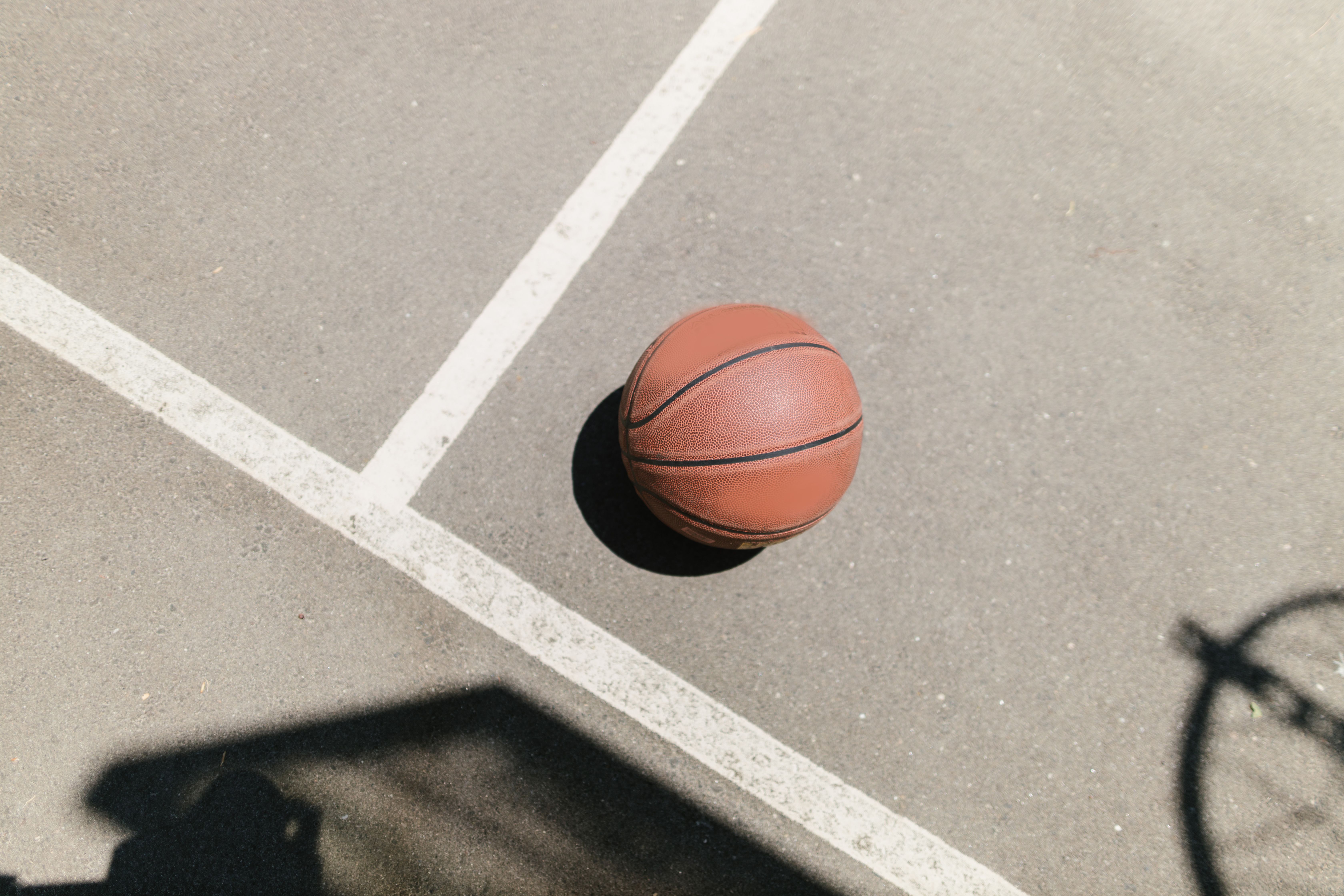 Brown Basketball on Concrete Ground · Free Stock Photo