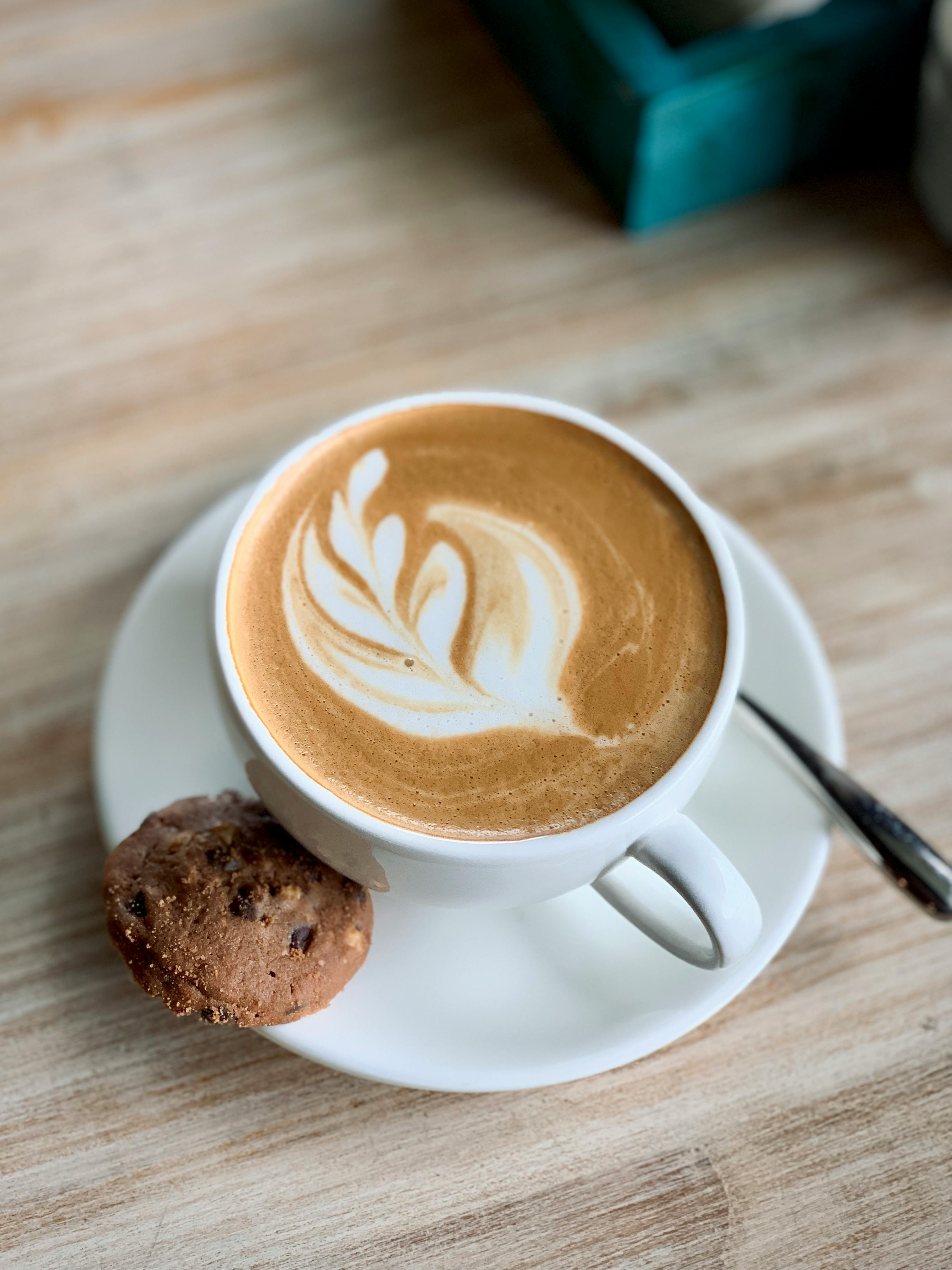 Grayscale Photo of a Cup of Coffee · Free Stock Photo