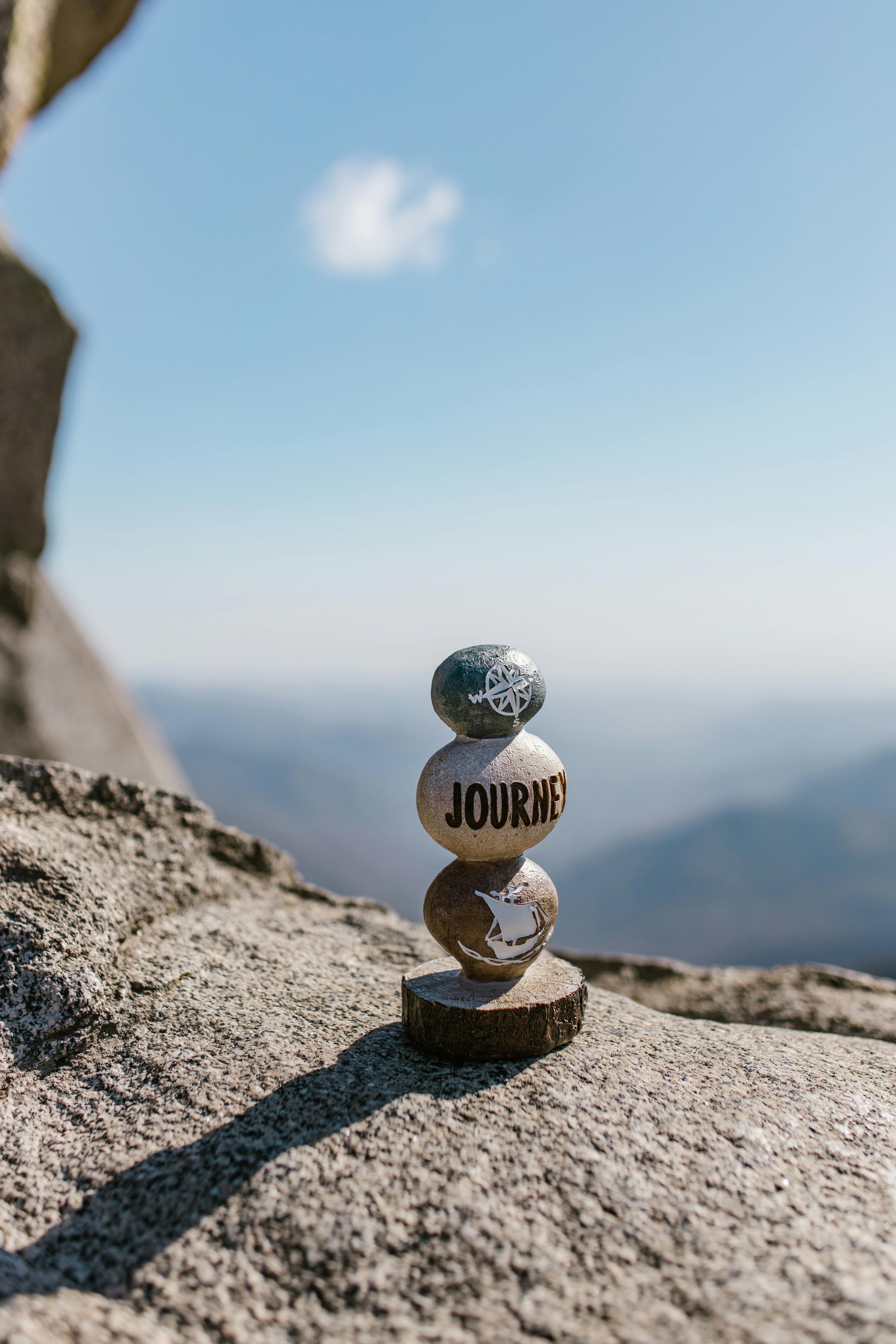 Journey Figure on Rock · Free Stock Photo