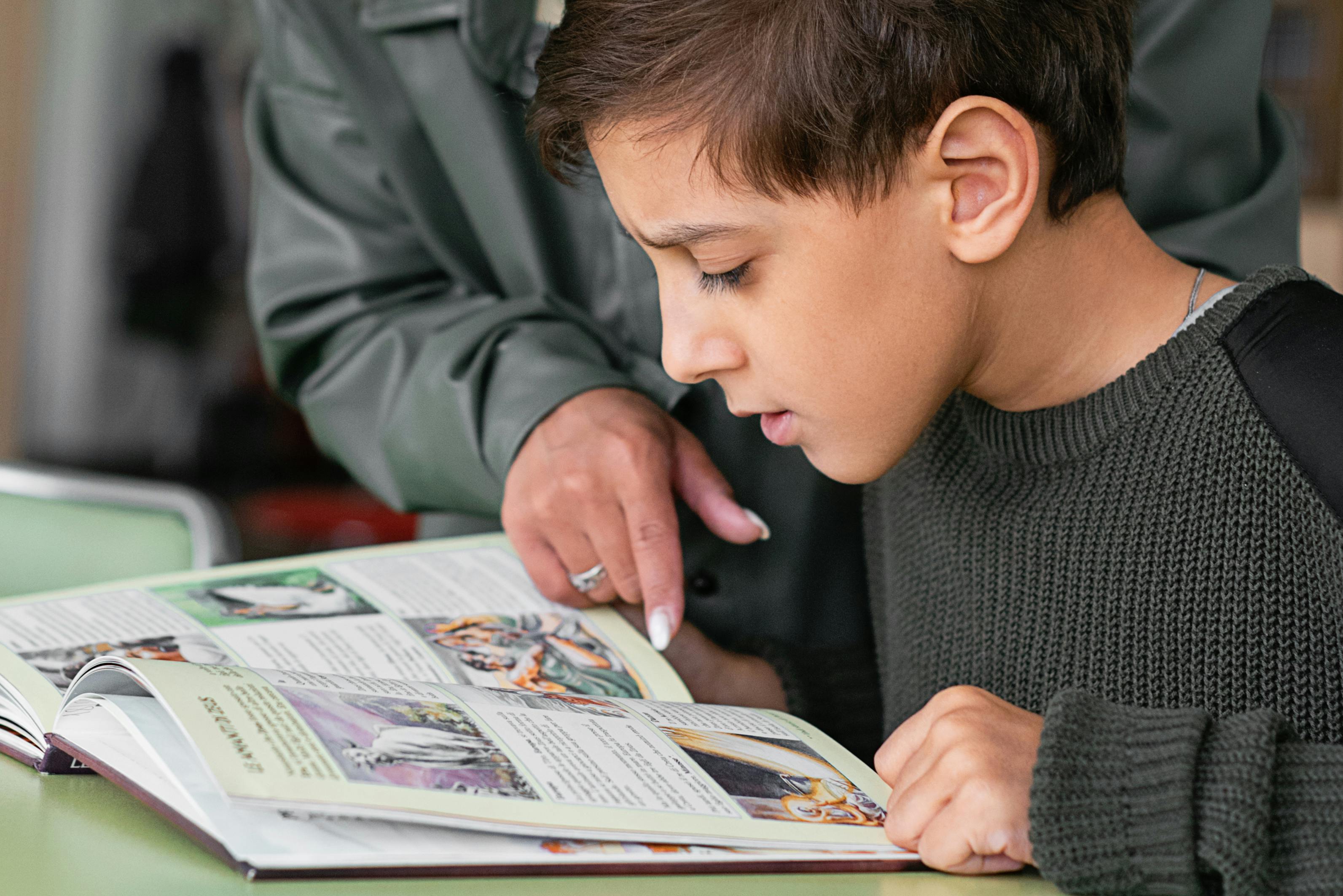 Boy Reading a Book · Free Stock Photo
