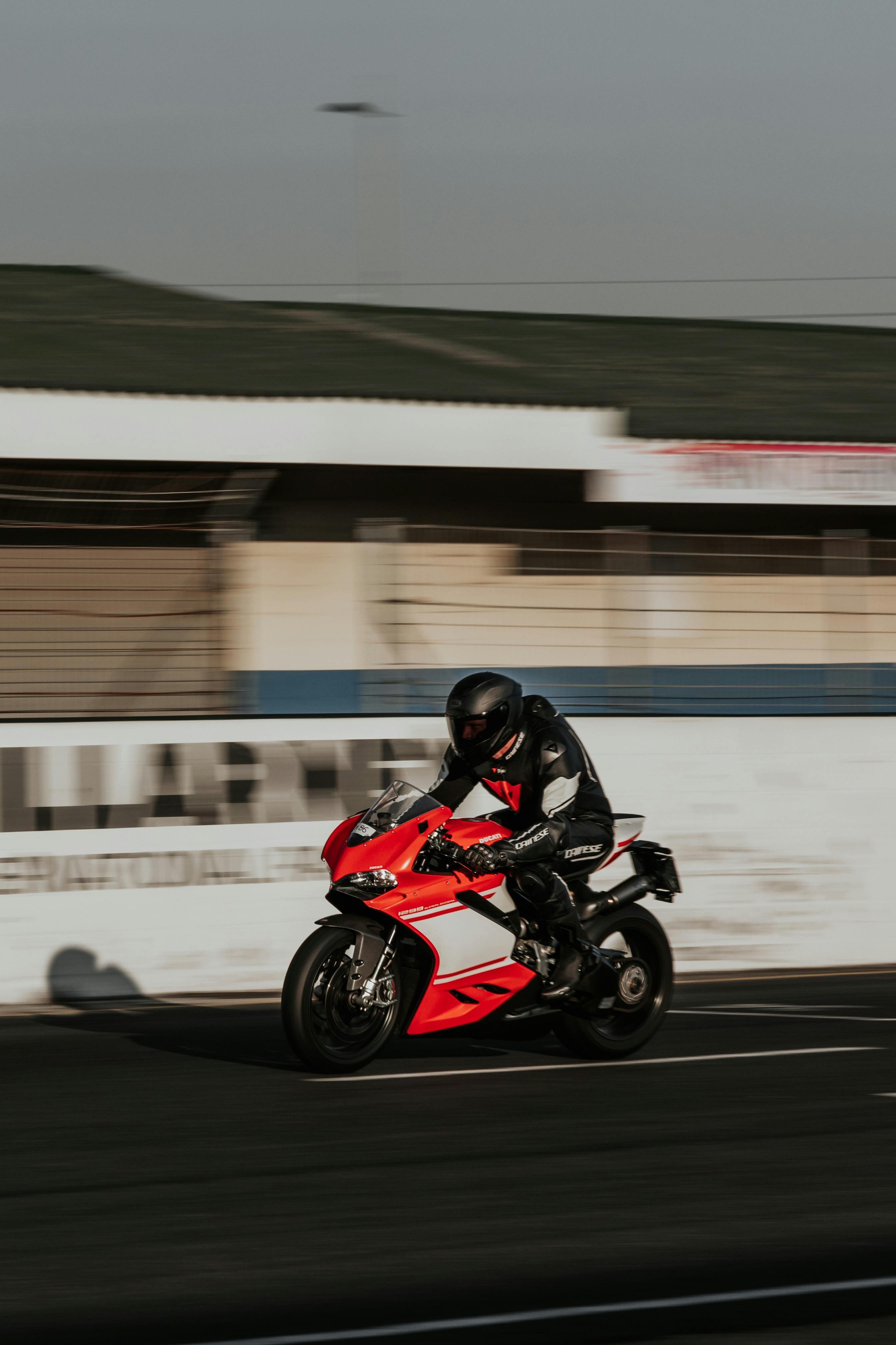 A Man Riding a Red Motorcycle · Free Stock Photo