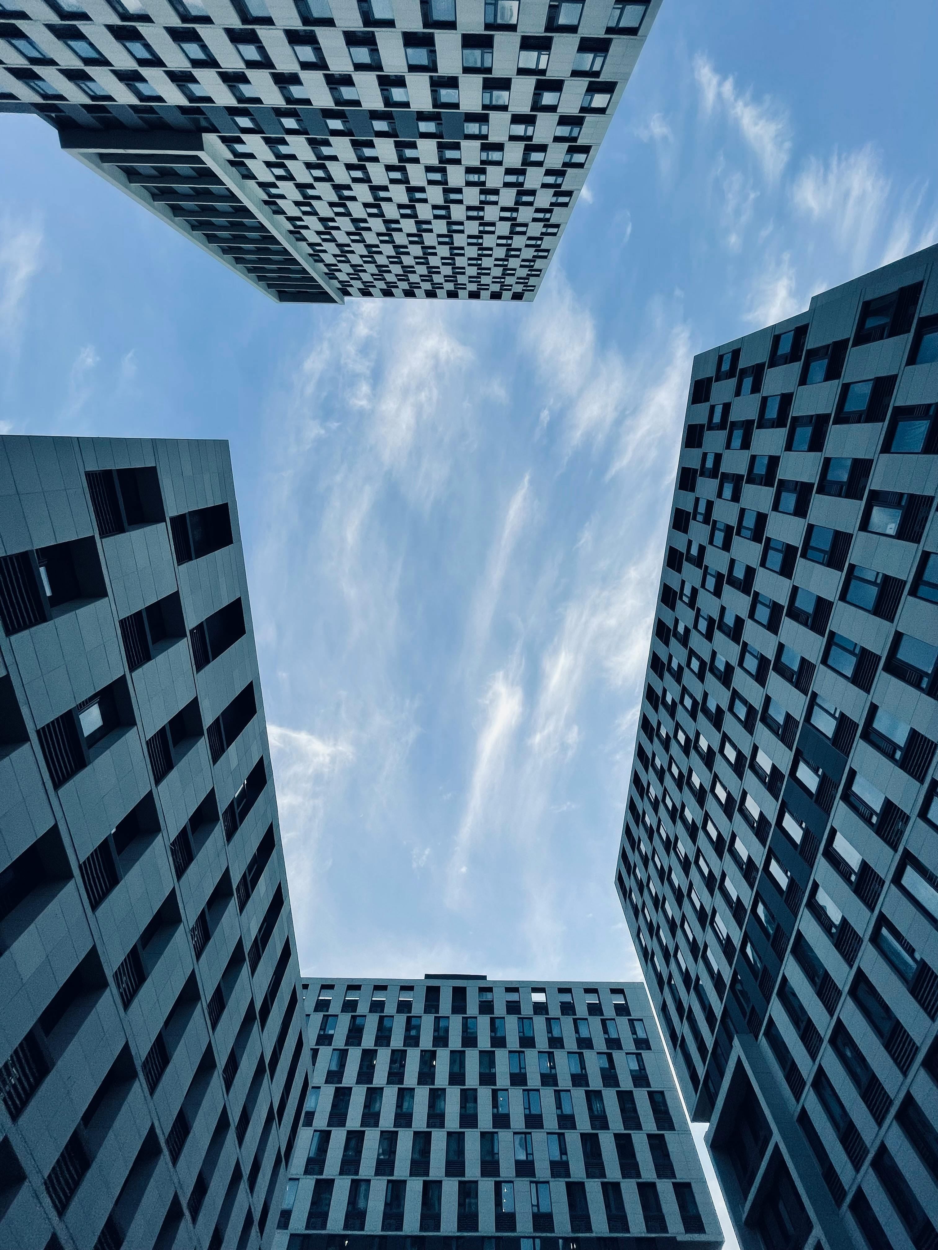 Low Angle Photography of High Rise Building Under Blue Sky · Free Stock ...