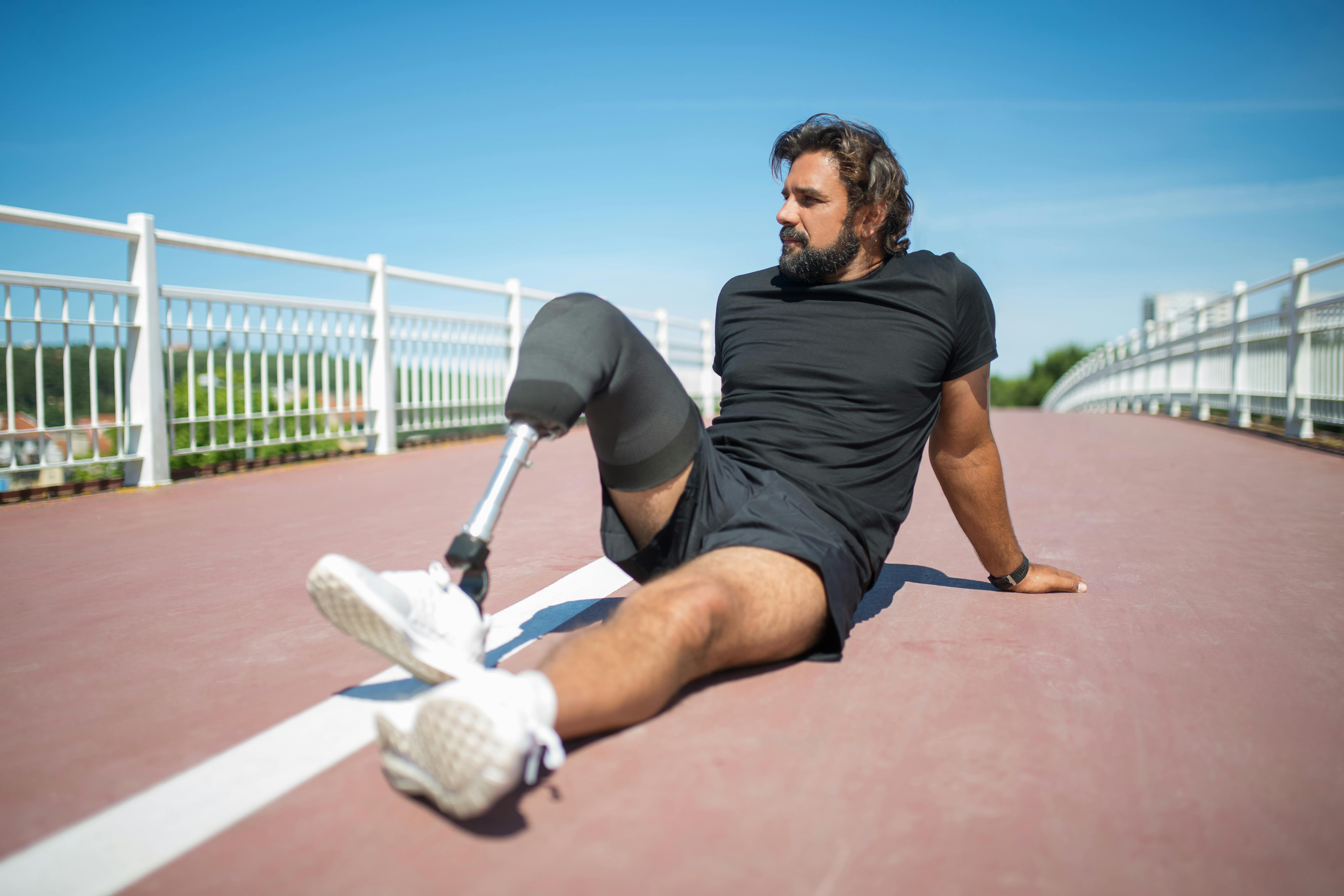A Man Fixing His Prosthetic Leg · Free Stock Photo