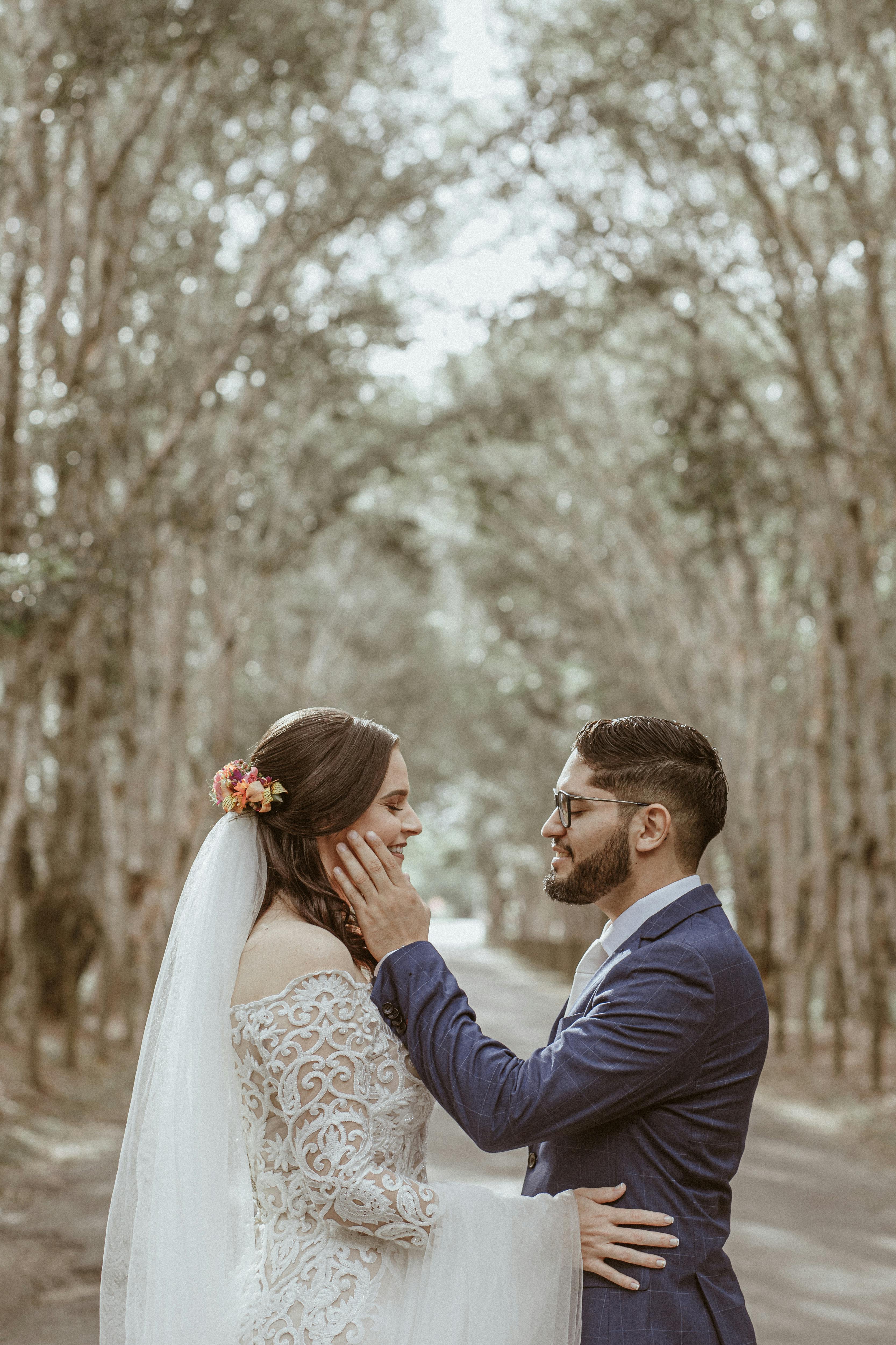 A Traditional Wedding Couple in a Temple · Free Stock Photo