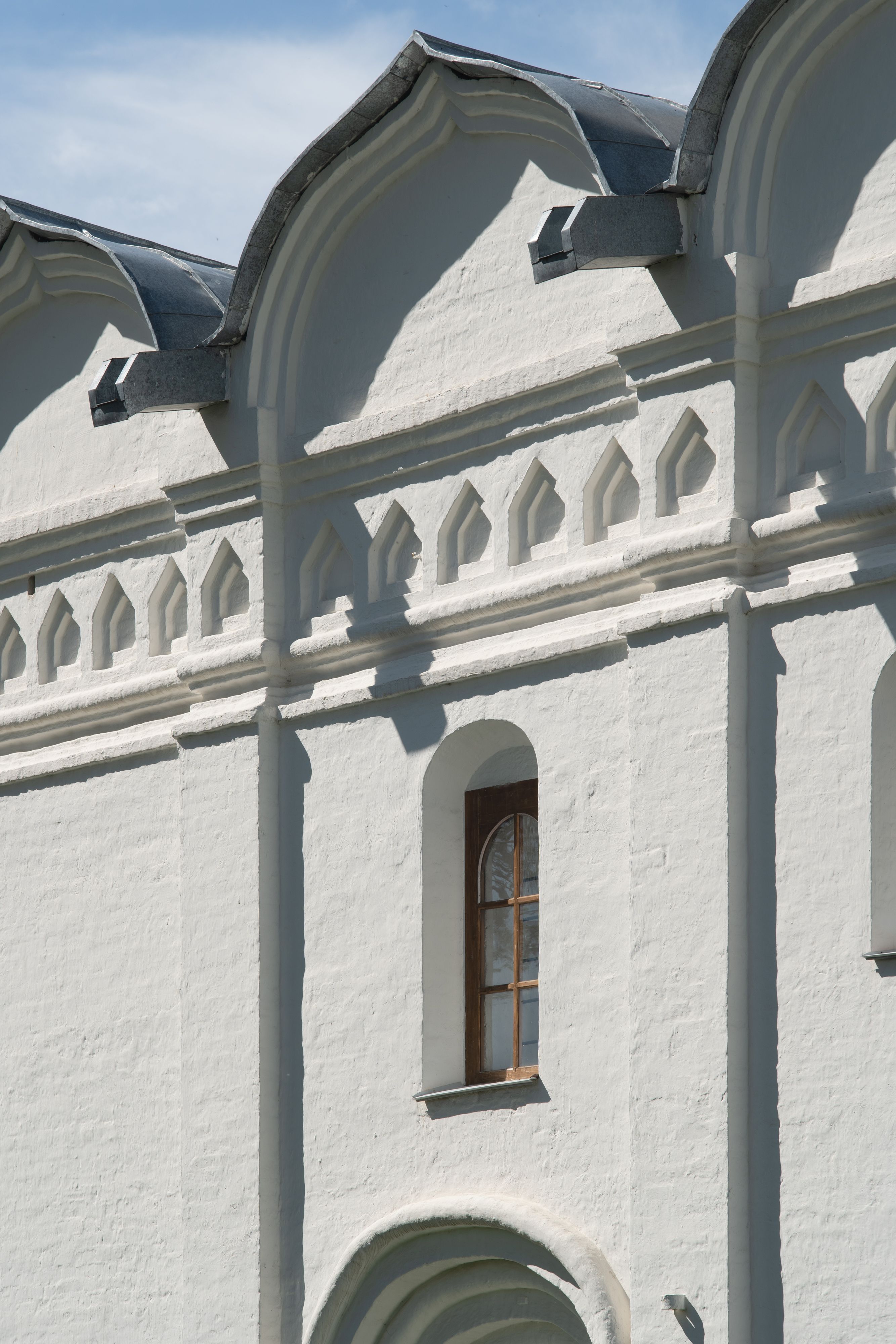 White Concrete Building With Arched Window · Free Stock Photo