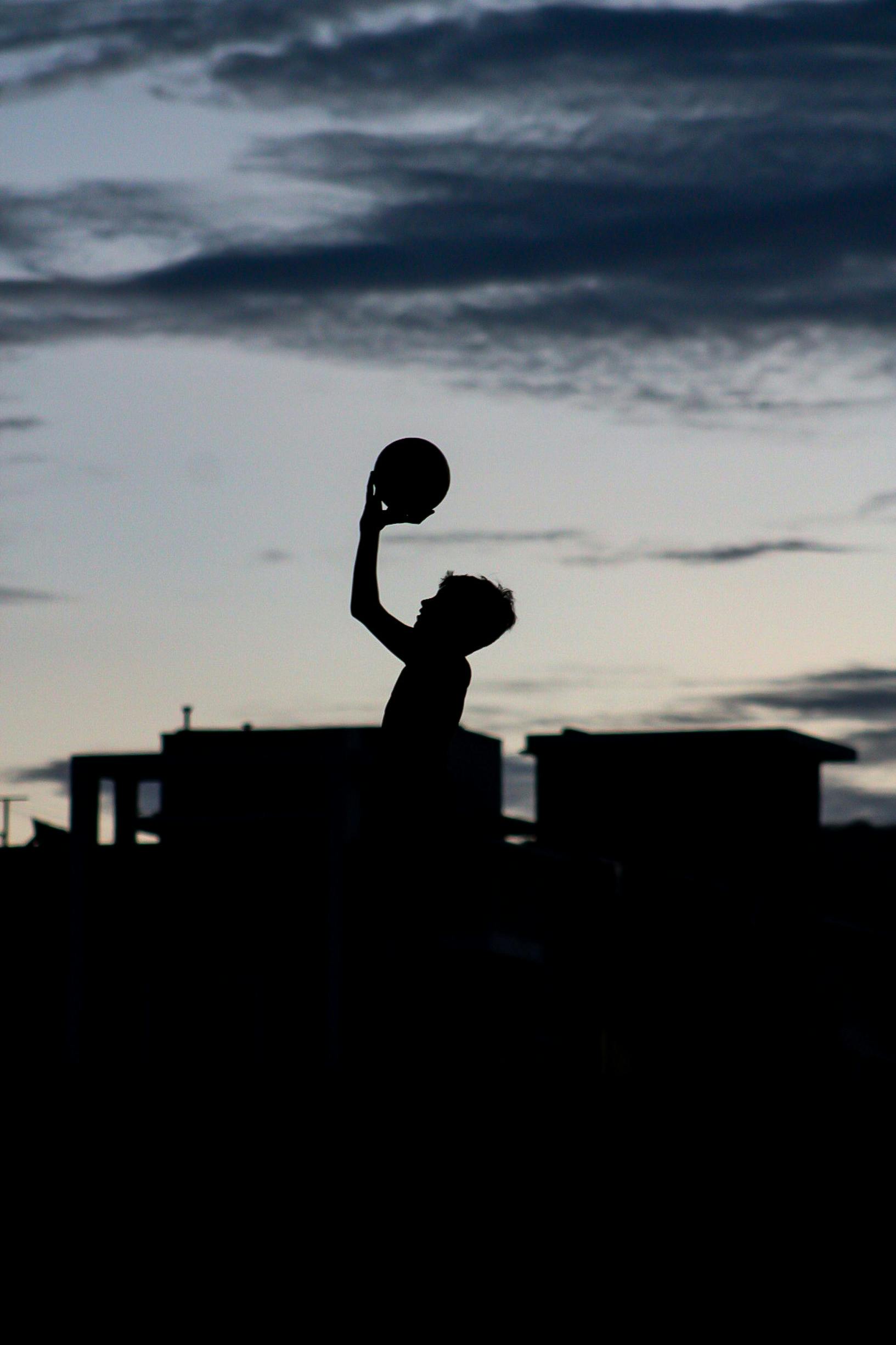 Left Handed Man Shooting a Basketball · Free Stock Photo