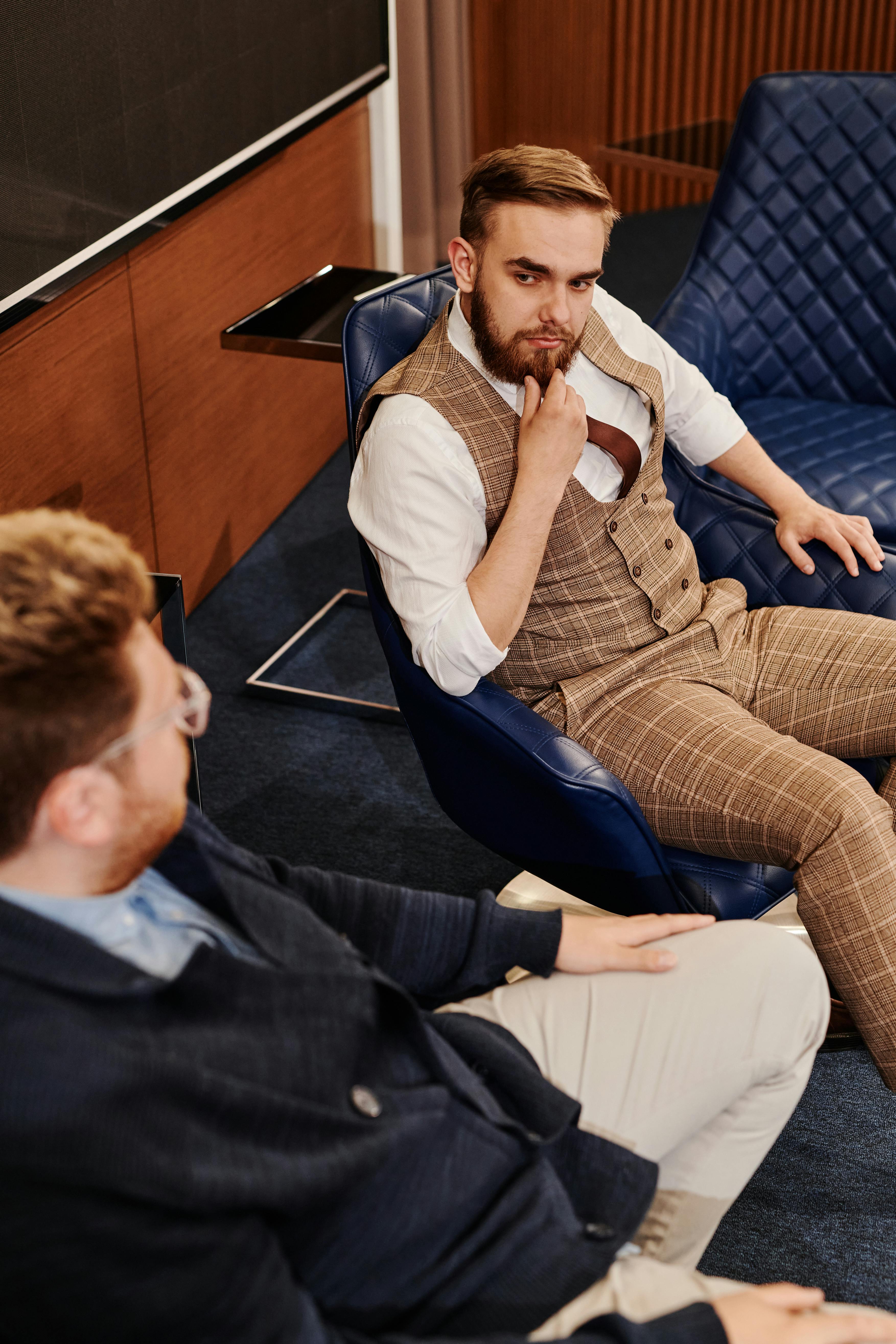Photo Of Man Sitting In Front · Free Stock Photo