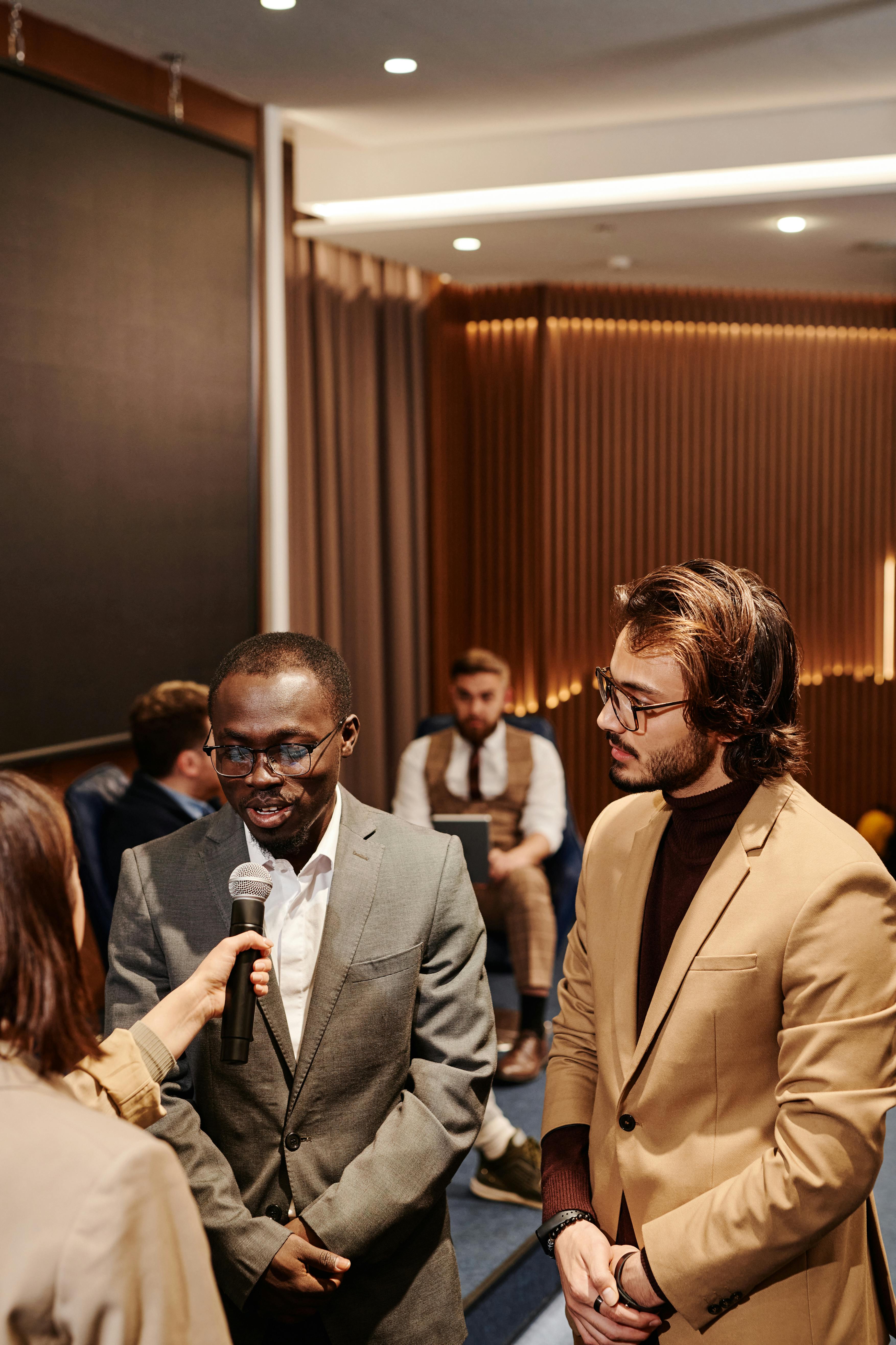 A Man in Corporate Attire Talking in an Interview · Free Stock Photo