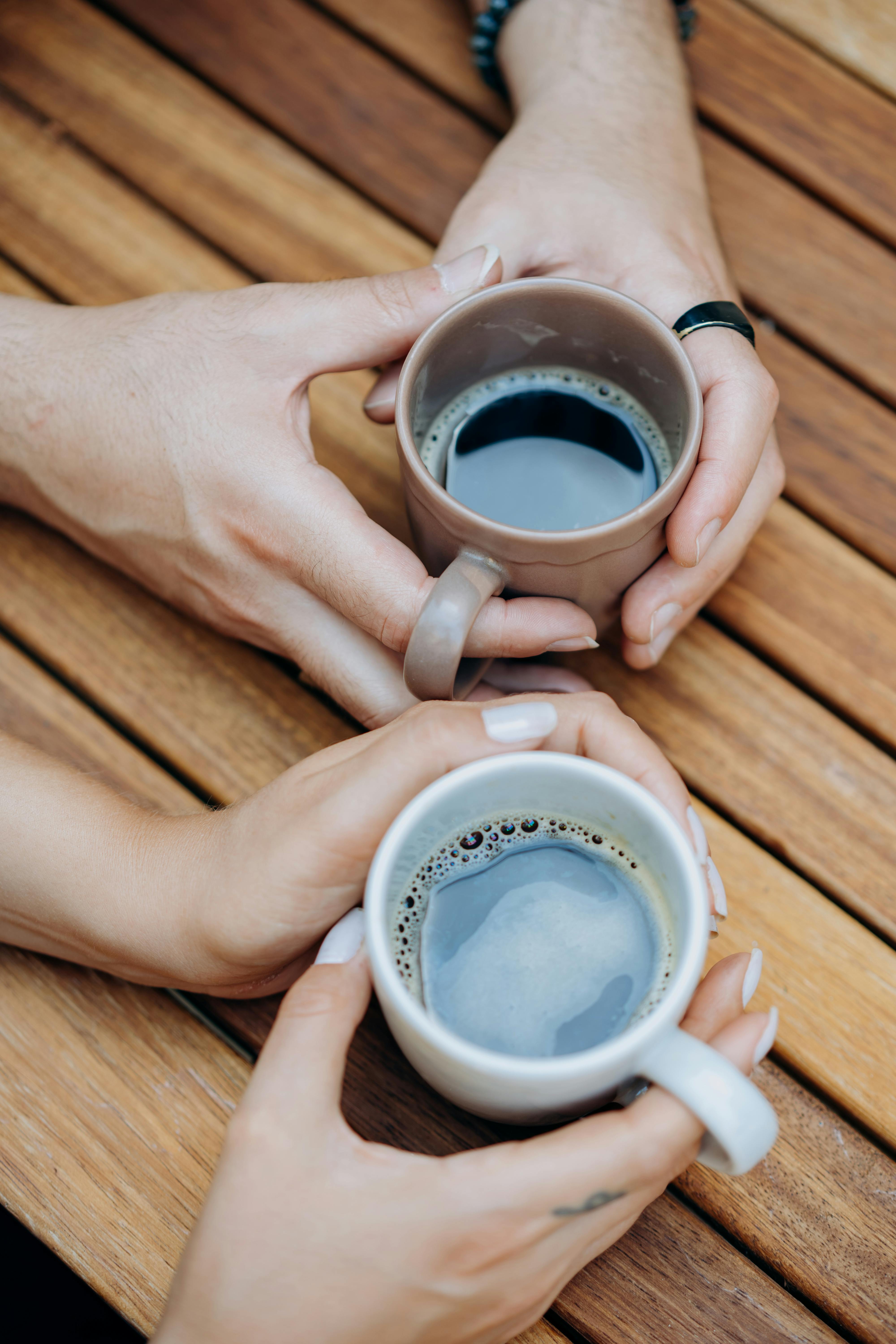 People Holding Mugs · Free Stock Photo