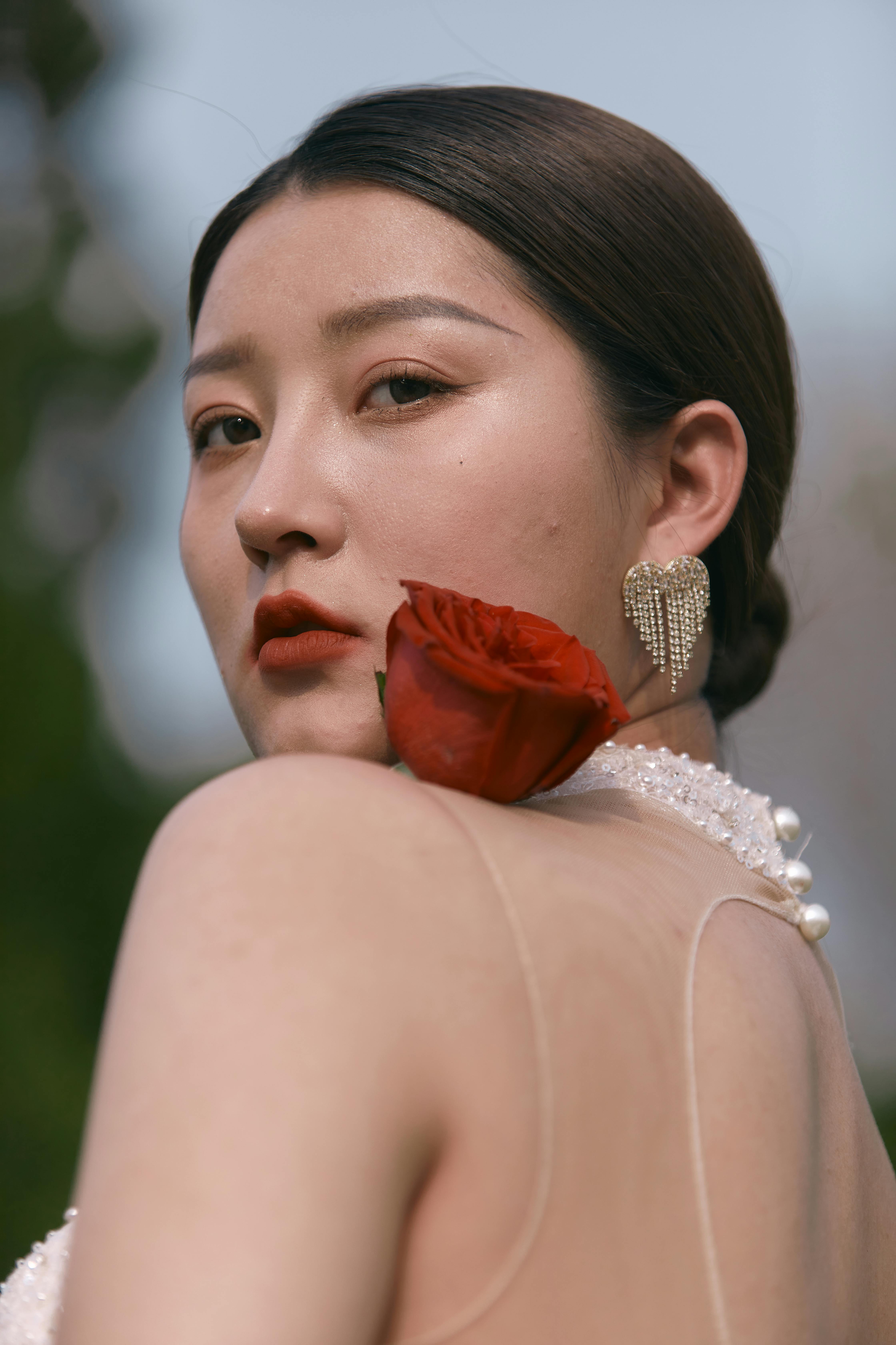 Woman with Rose on Her Shoulder · Free Stock Photo