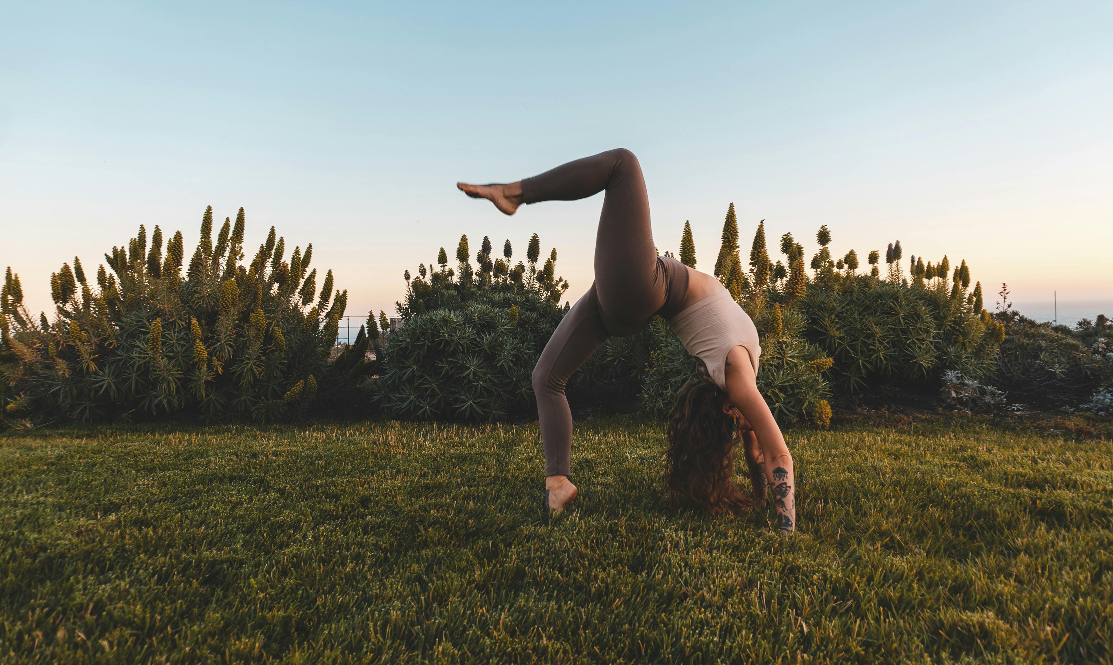 Woman in Brown Dress Bending Her Back on Wheat Field · Free Stock Photo