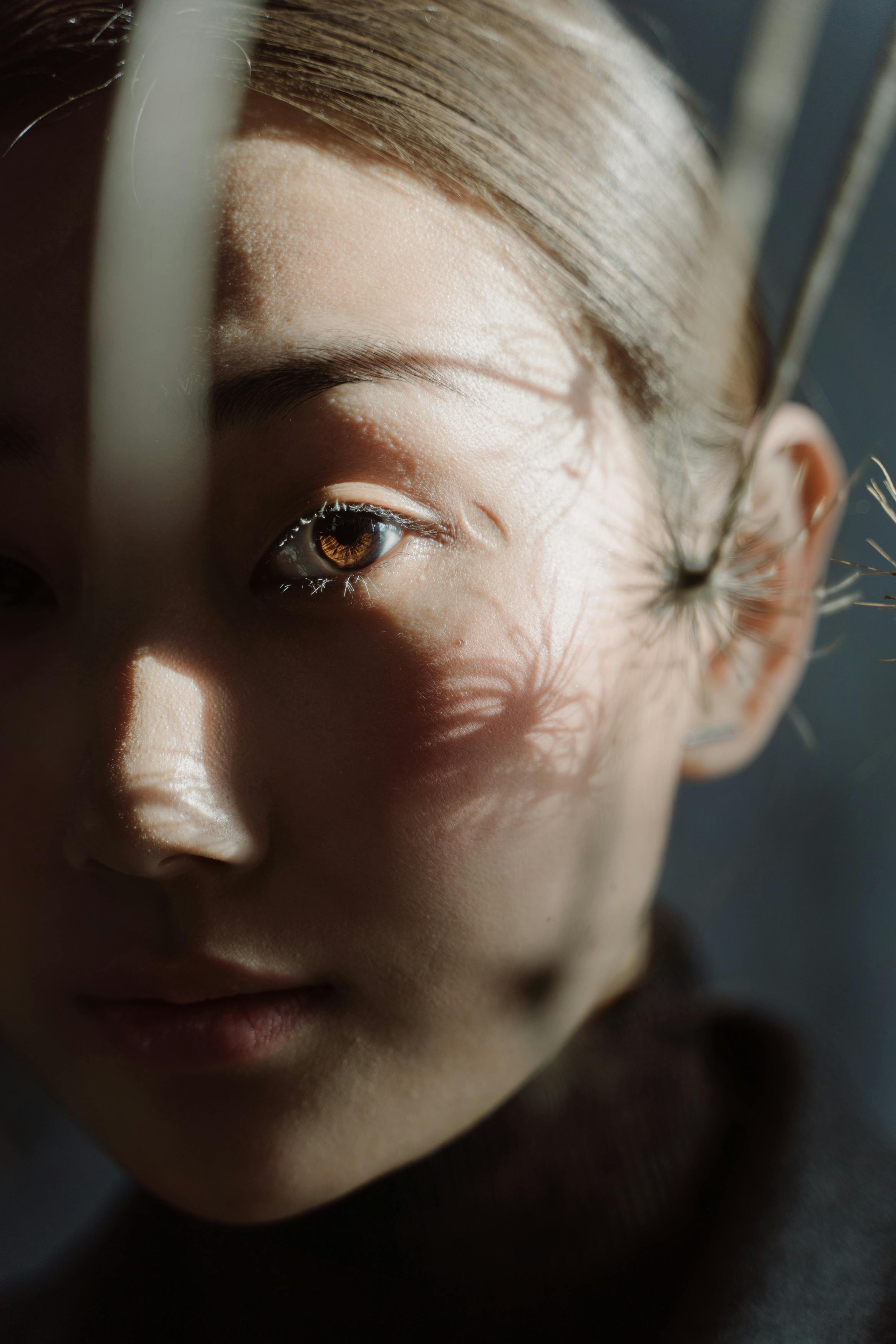 Woman with Prism Light Reflection on her Face · Free Stock Photo