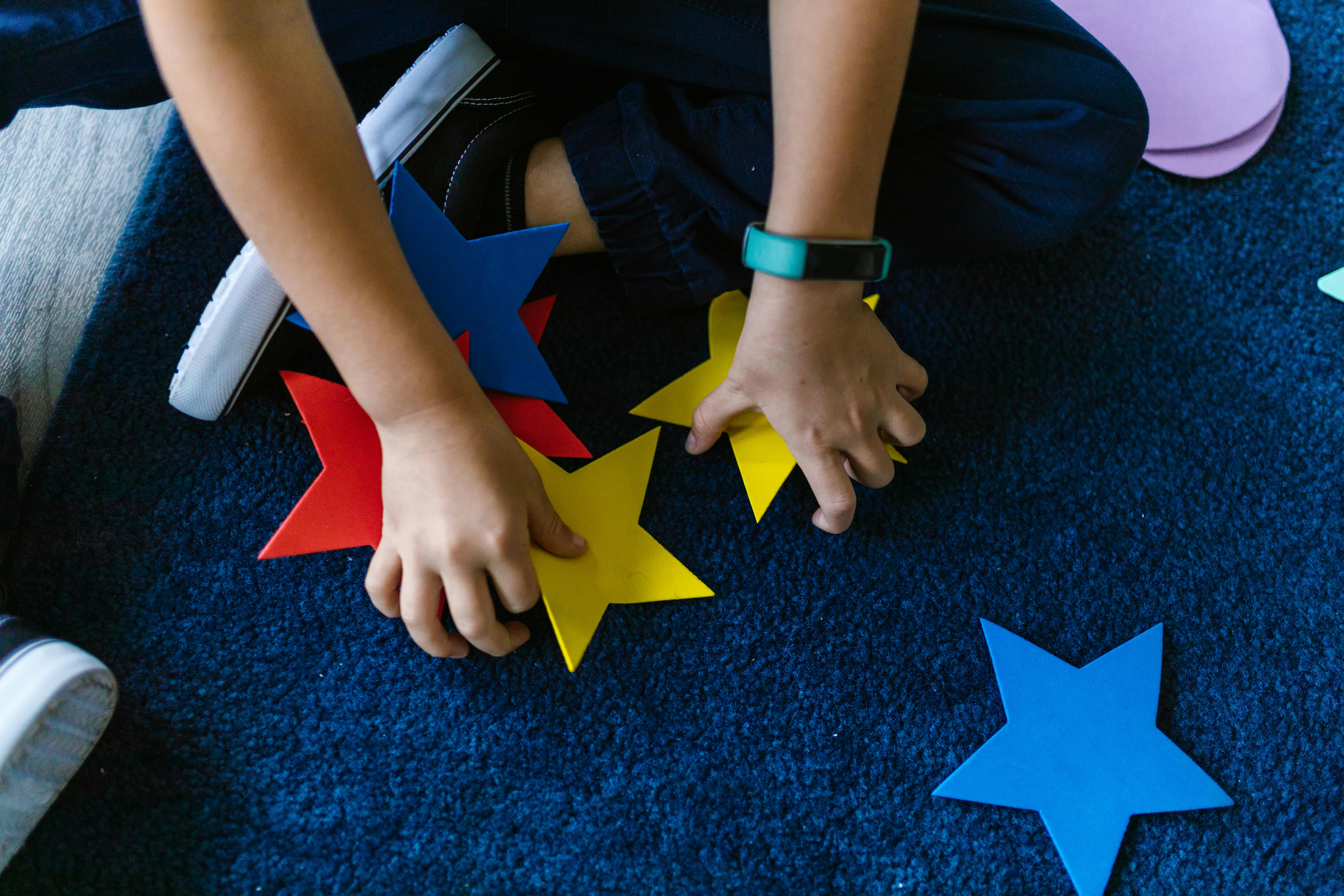 Bright Colors Stars on the Floor Carpet · Free Stock Photo