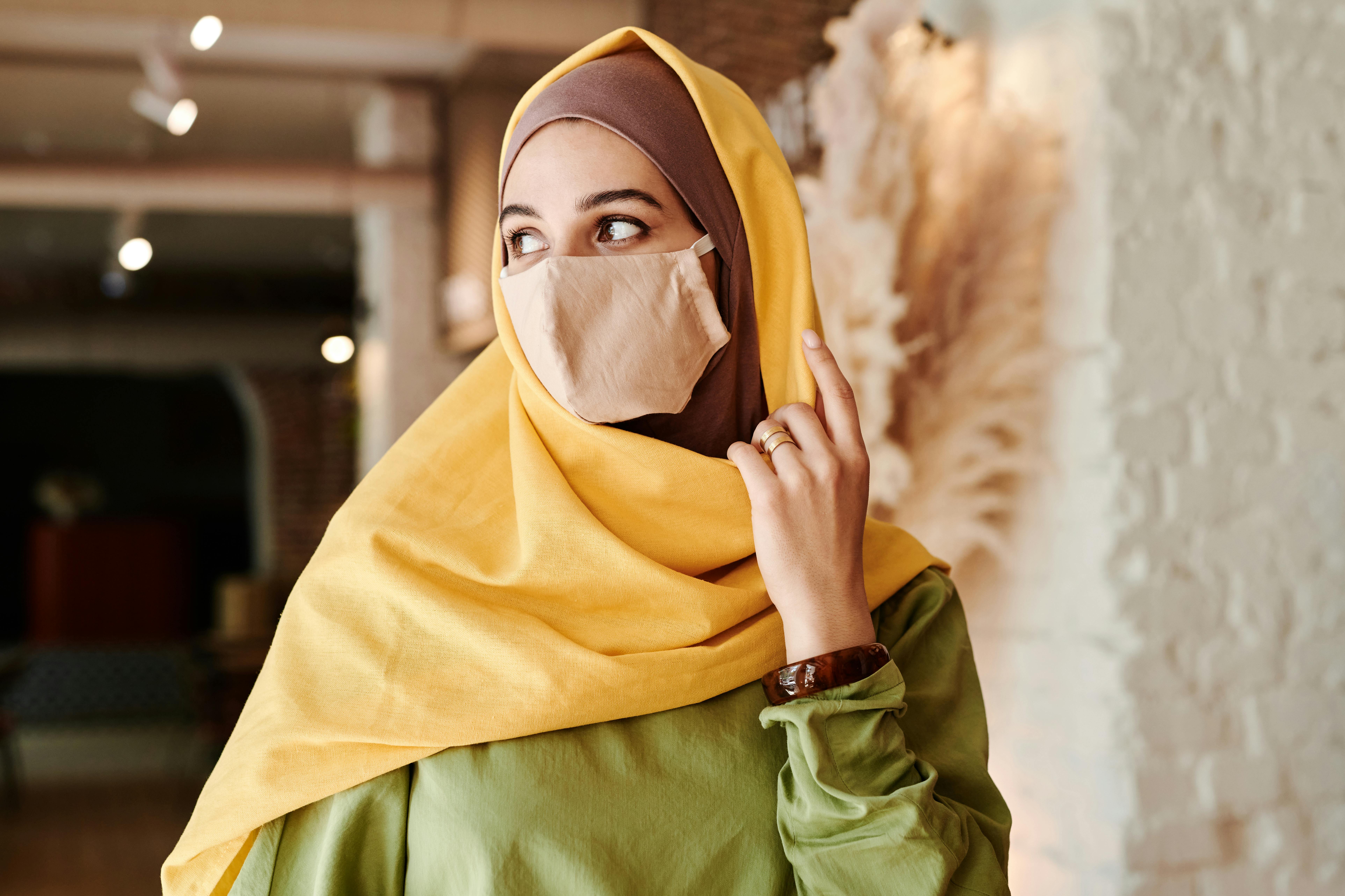 Woman in Black Hijab with Metal Facemask · Free Stock Photo