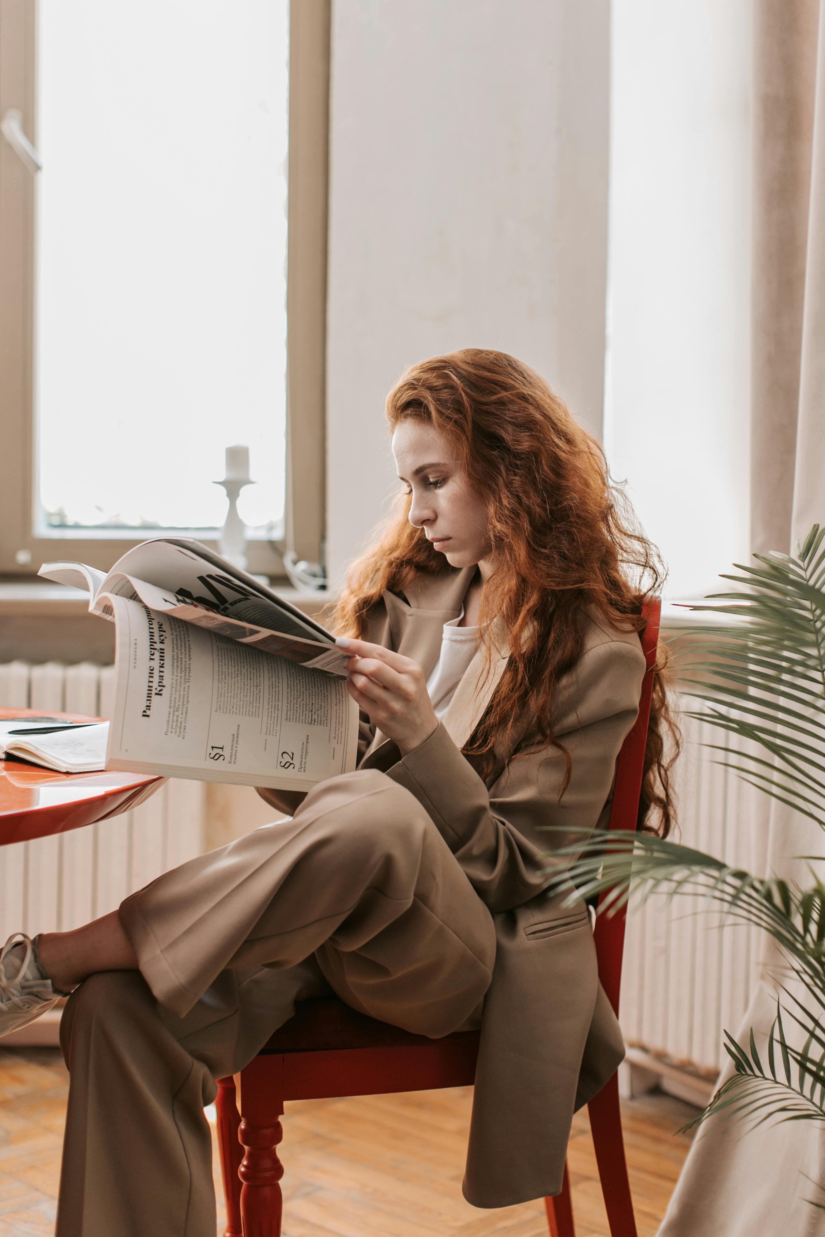 A Woman Reading a Magazine · Free Stock Photo