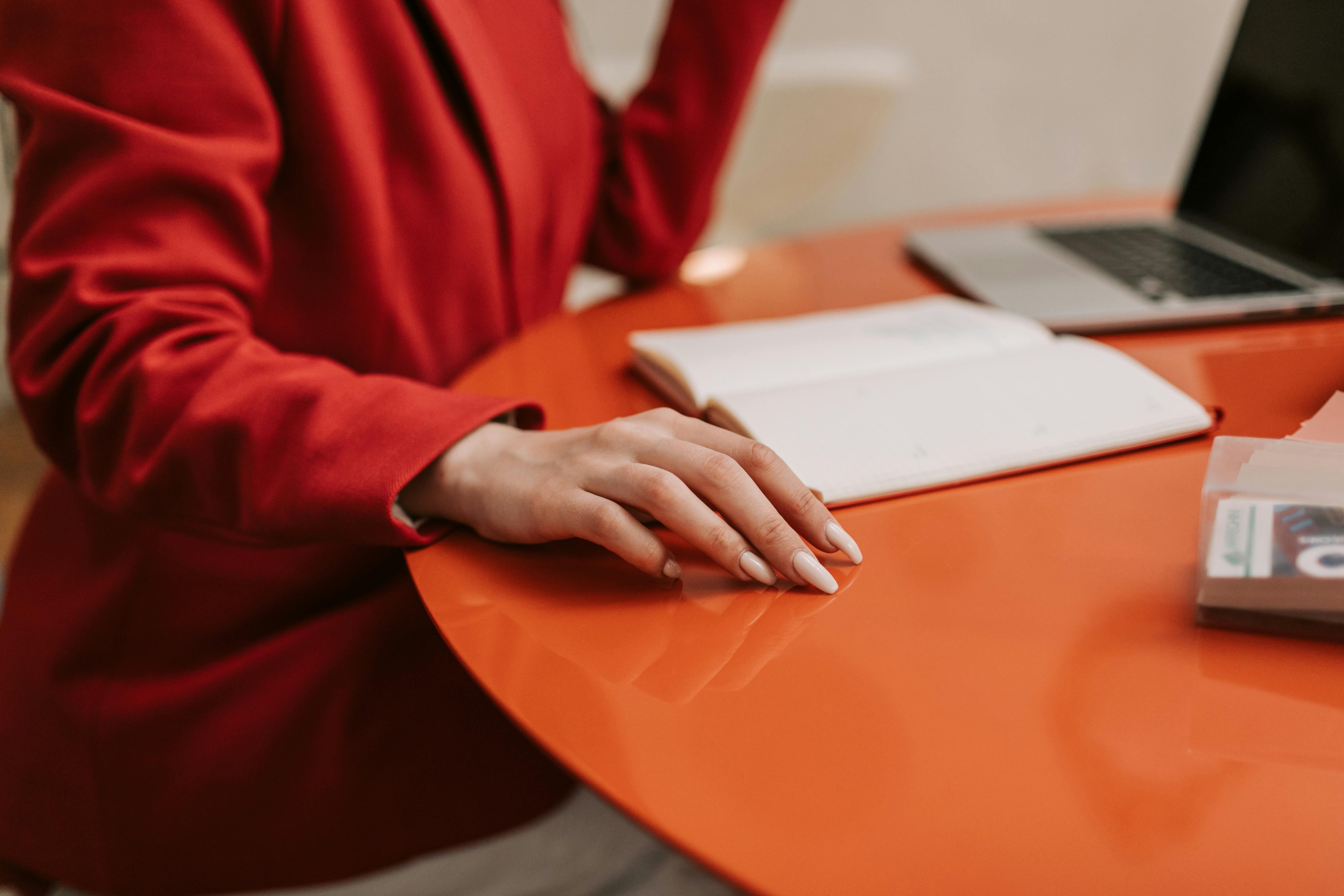 A Woman Sitting in Behind a Round Table · Free Stock Photo