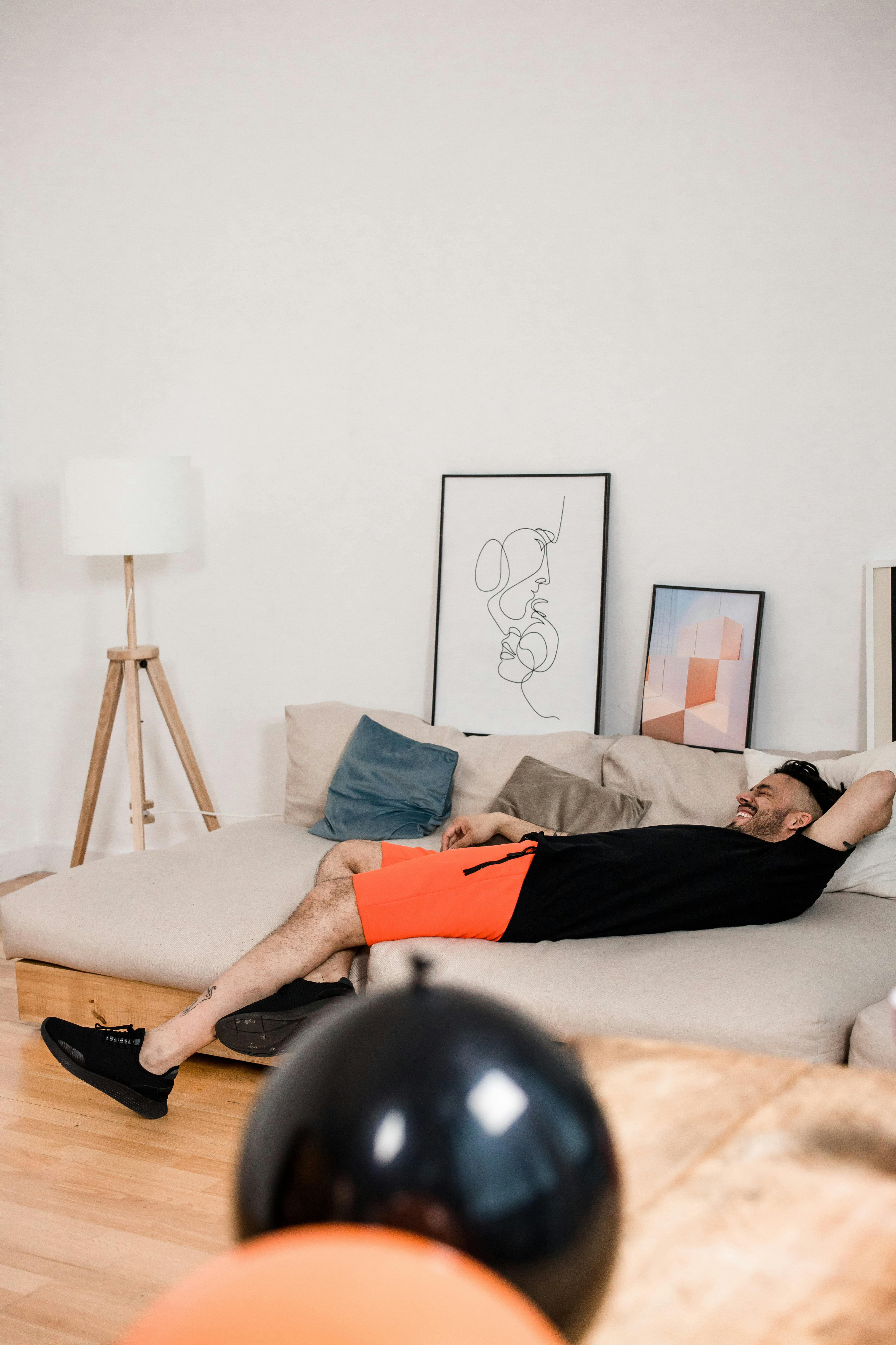 Man Lying Down on a Sofa · Free Stock Photo
