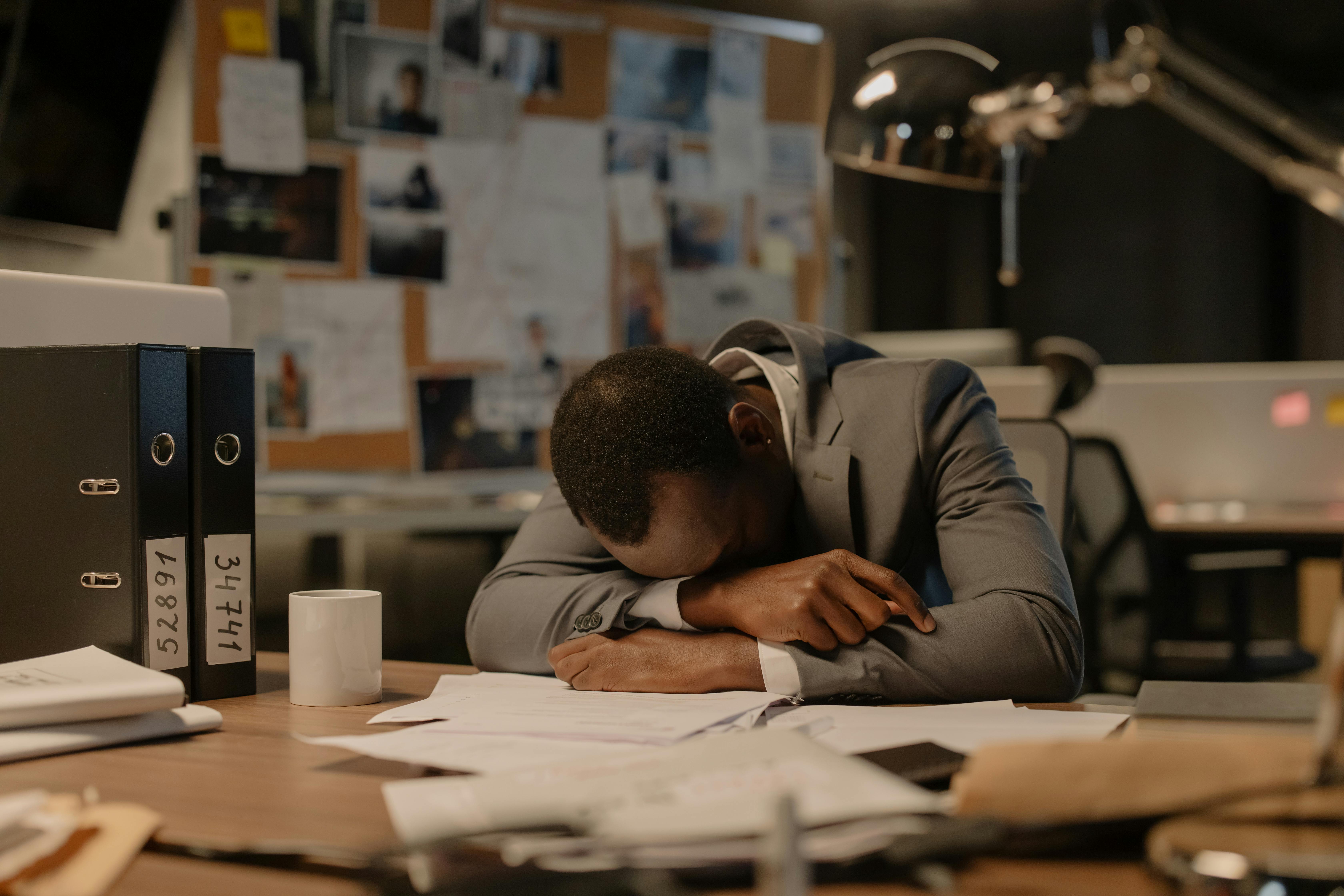 Woman Putting Her Head Down on the Desk · Free Stock Photo