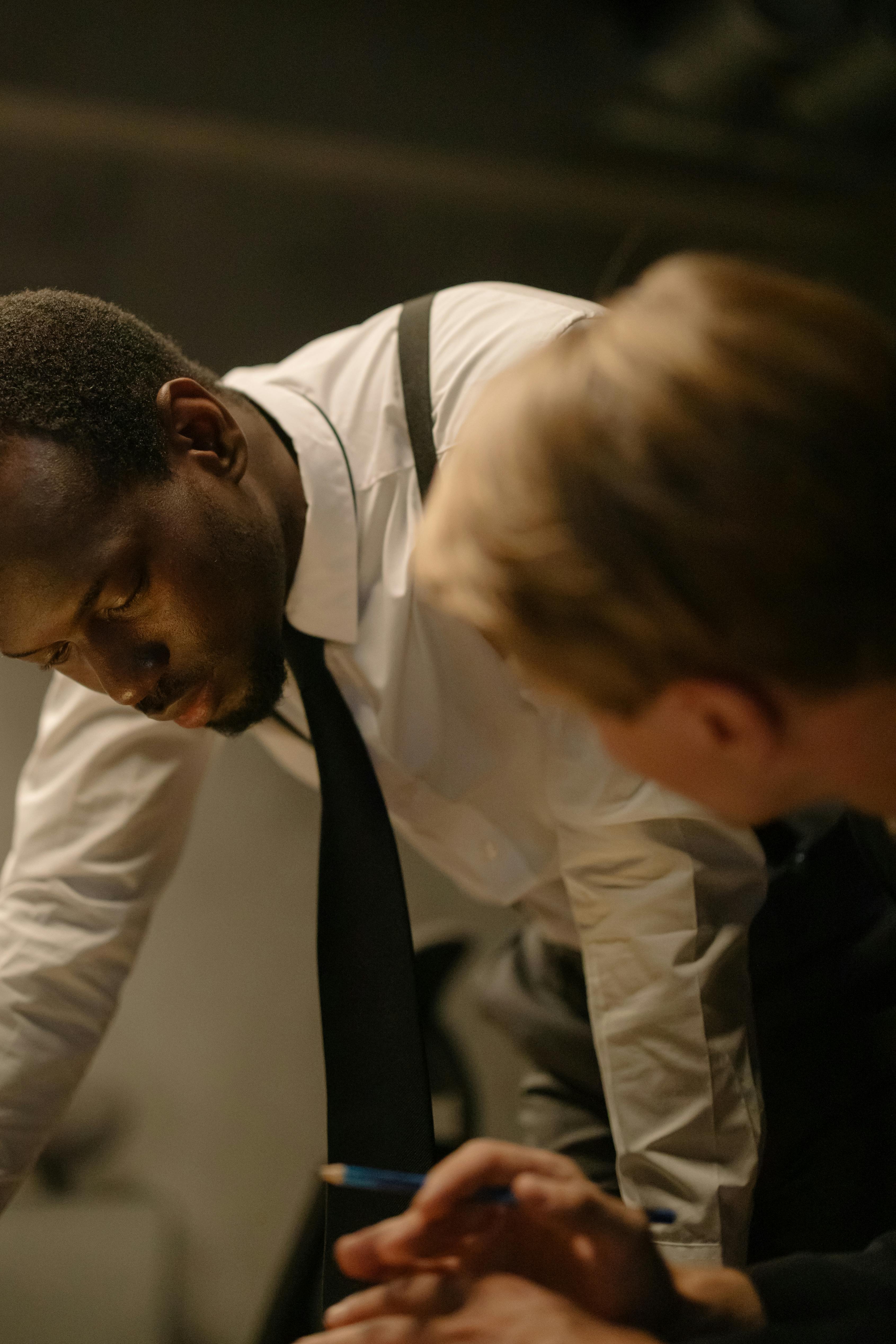 Close-Up Shot of Two Investigators Working · Free Stock Photo