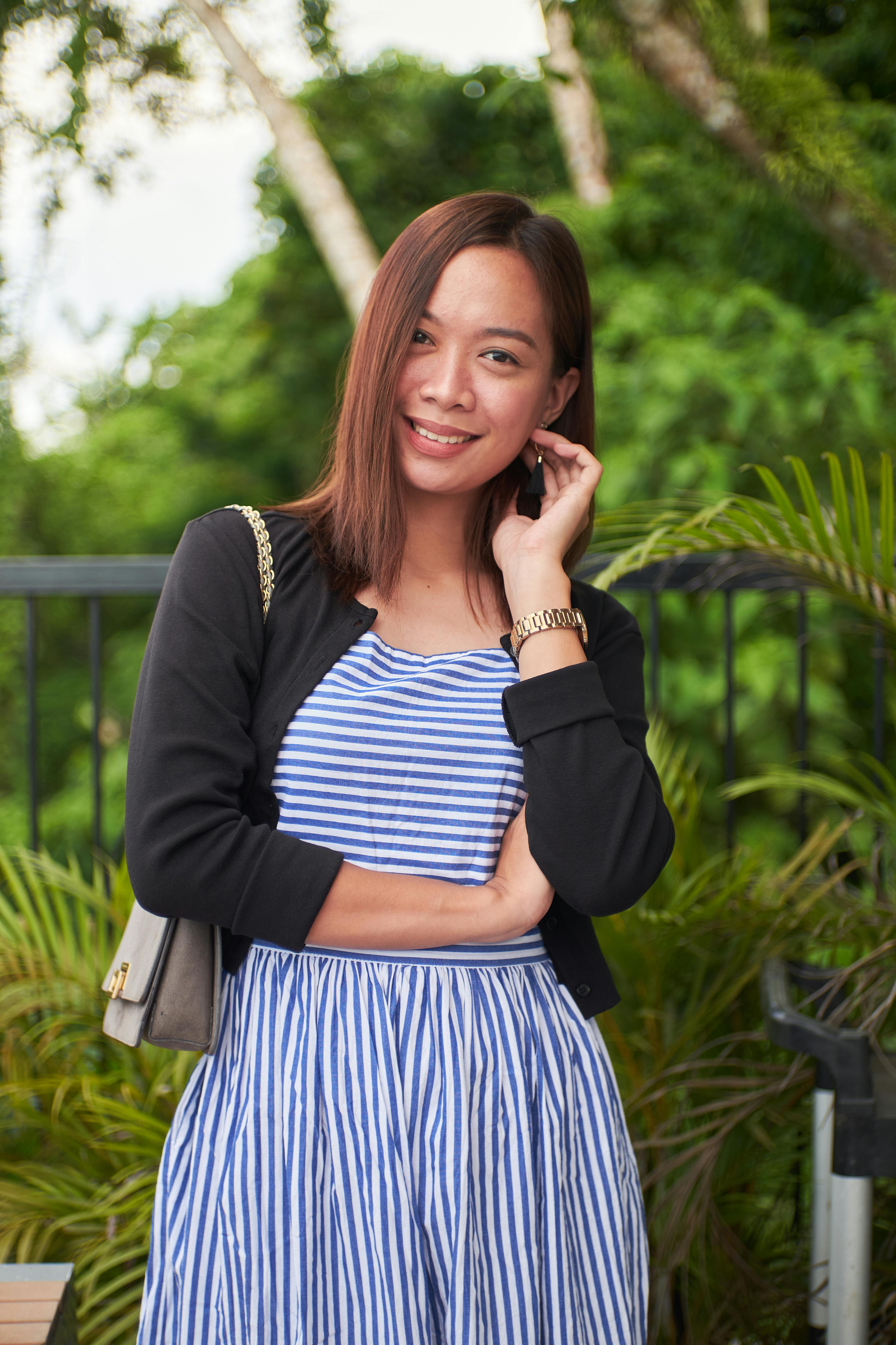 Portrait of a Woman Wearing Striped Dress · Free Stock Photo