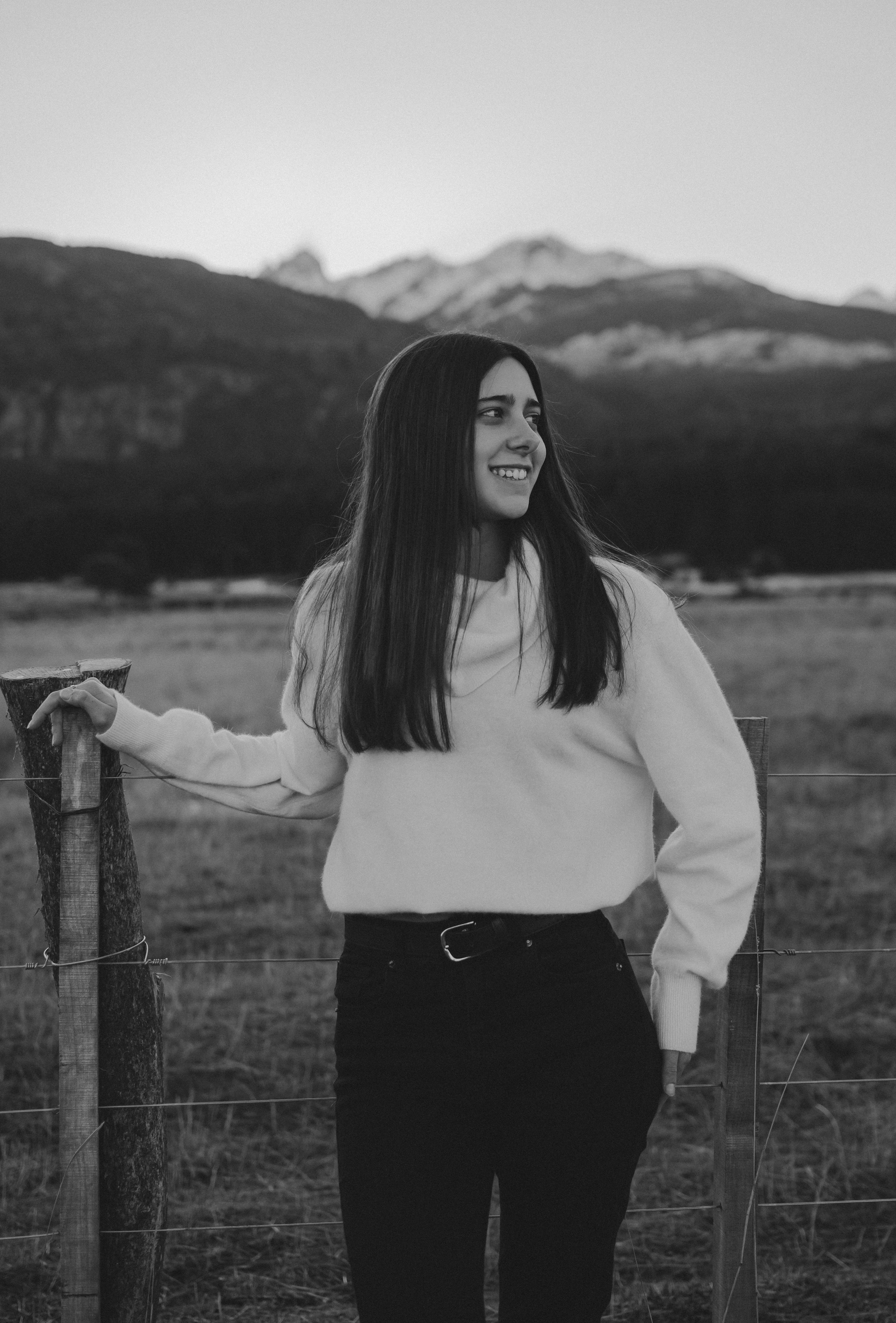 Black and White Portrait of Woman Looking Over Shoulder · Free Stock Photo