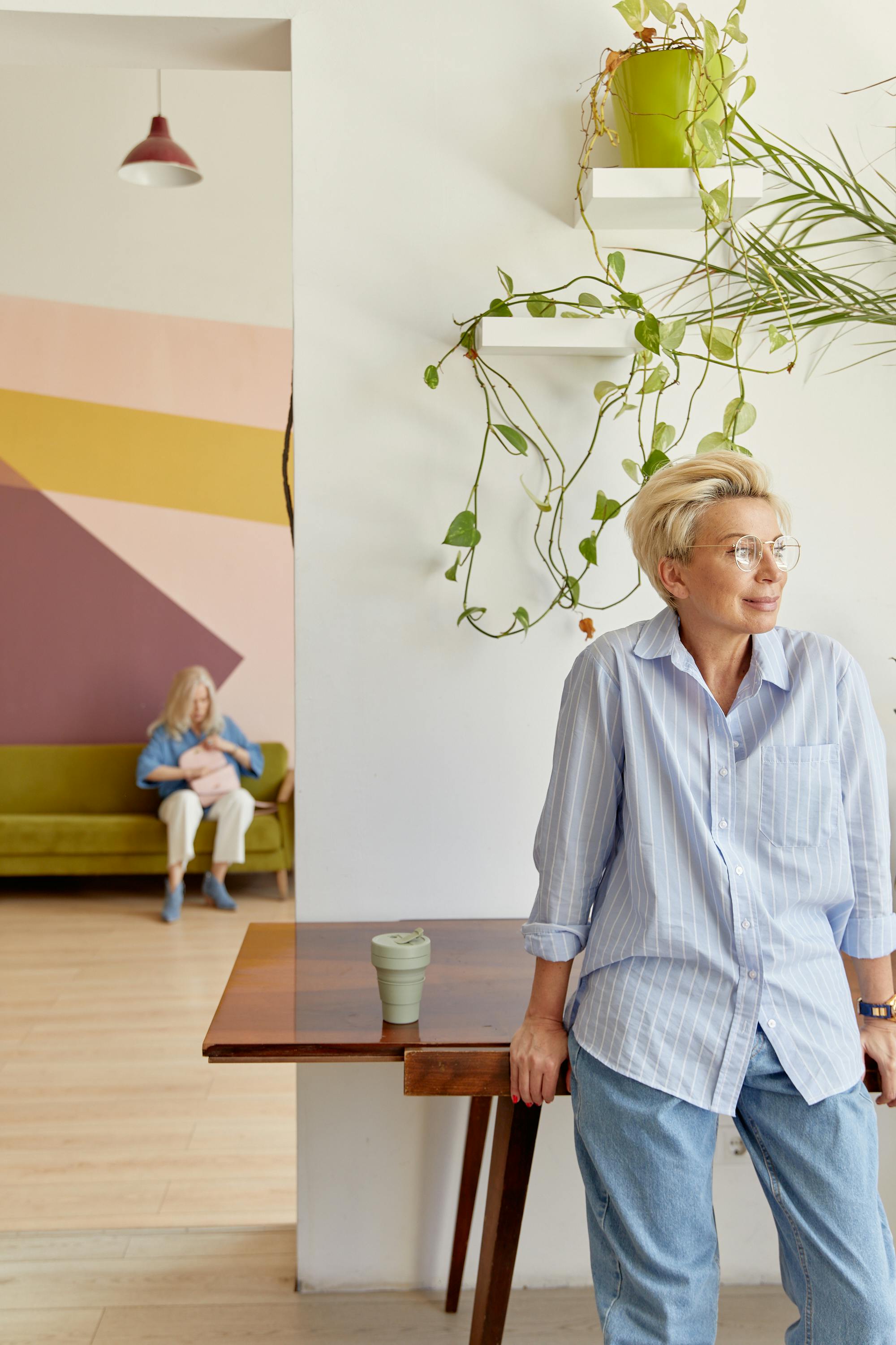 Woman Leaning on a Table · Free Stock Photo