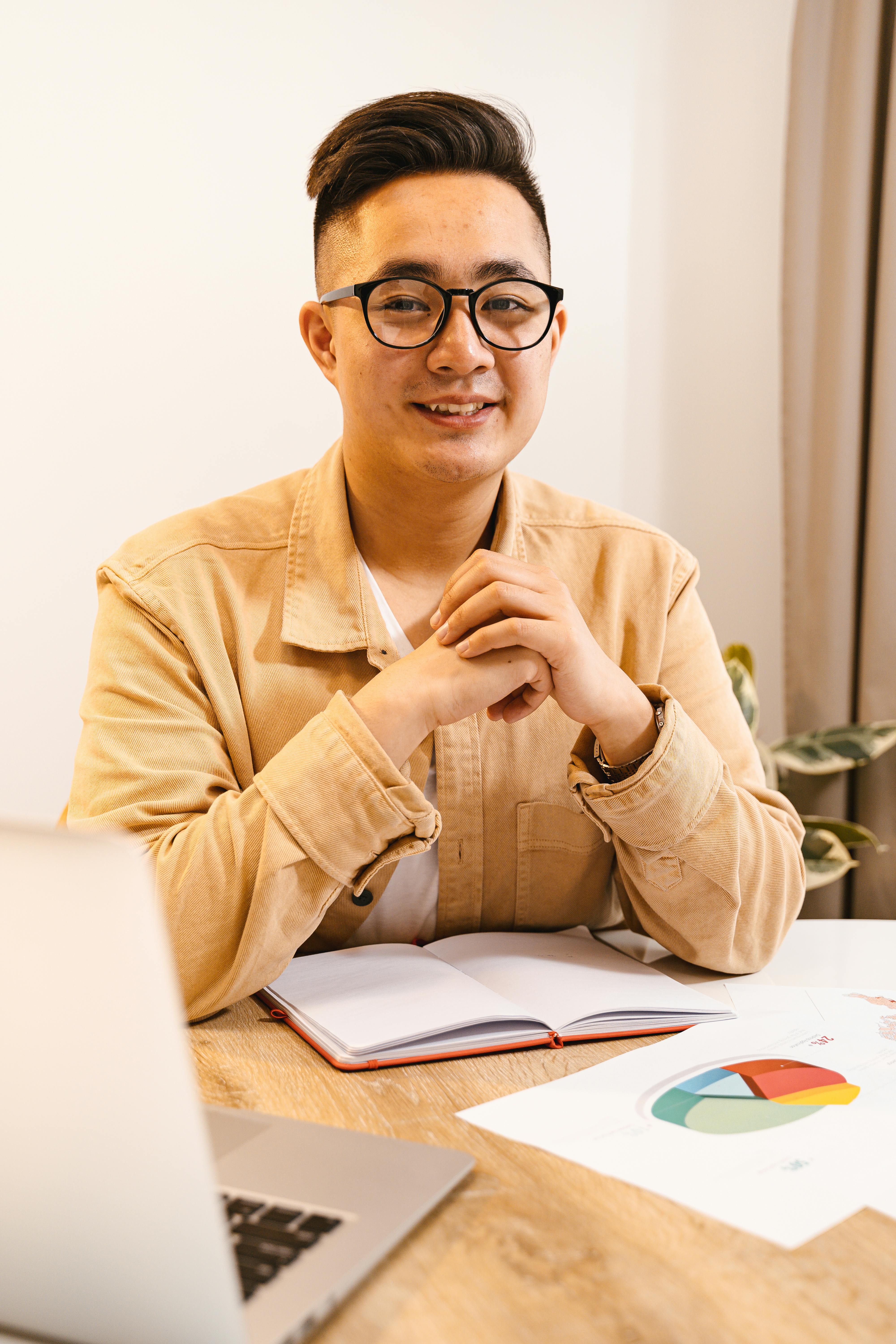Portrait of Man Sitting by Desk at Work · Free Stock Photo