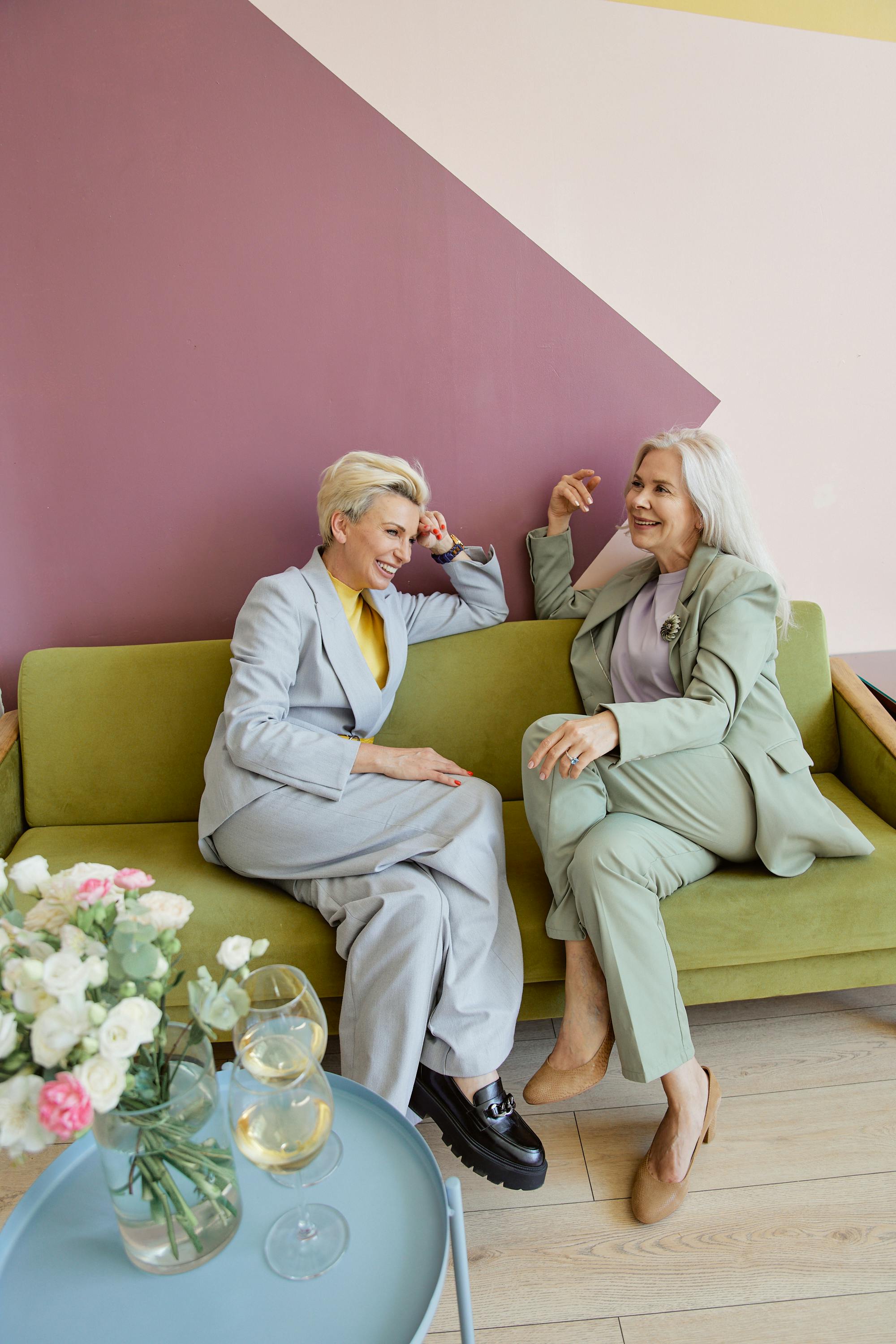Women Having a Conversation while Sitting on a Couch · Free Stock Photo