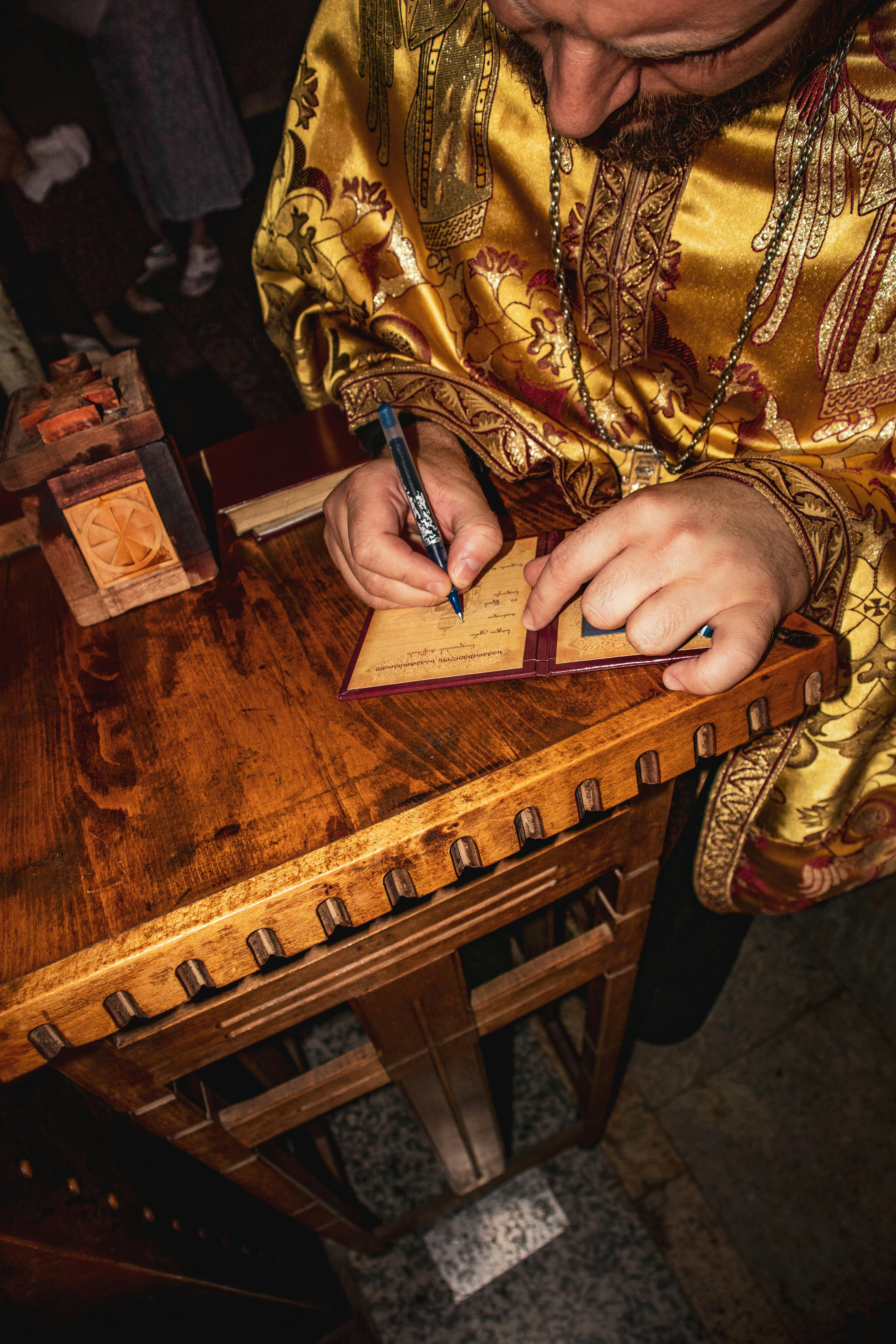 A Priest Reading a Scripture · Free Stock Photo