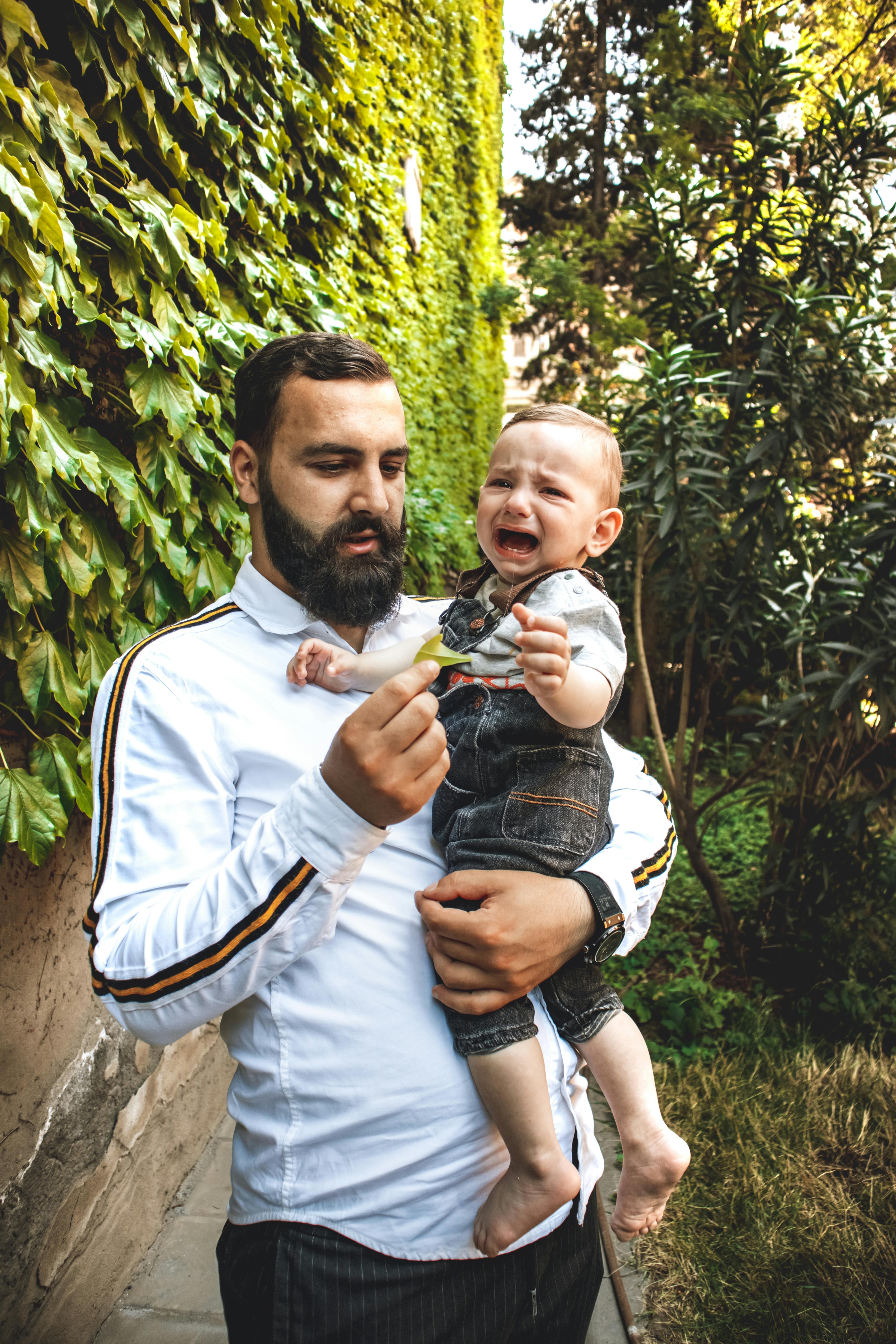 Man Carrying His Baby · Free Stock Photo