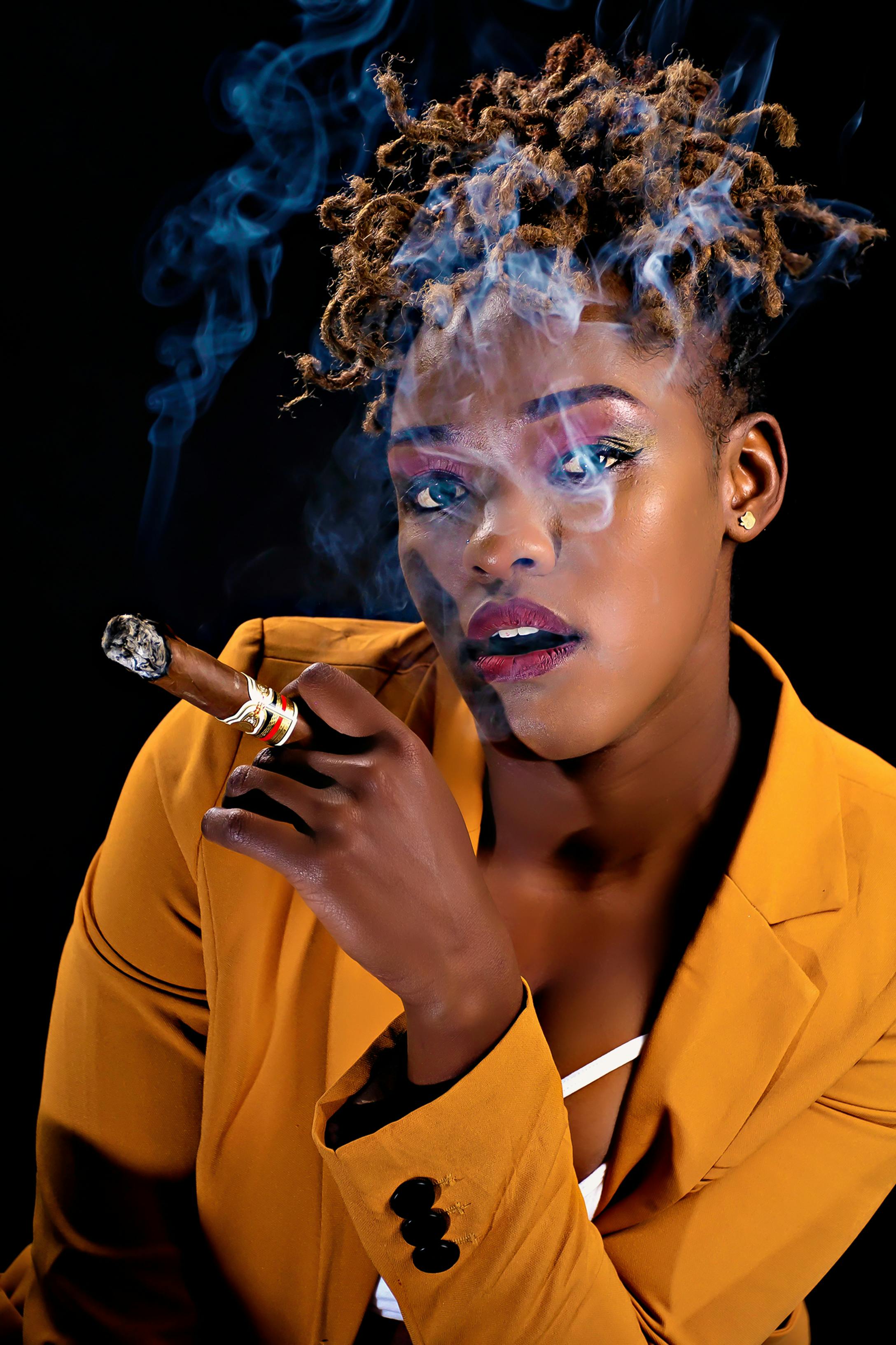 A Woman Smoking a Cigar · Free Stock Photo