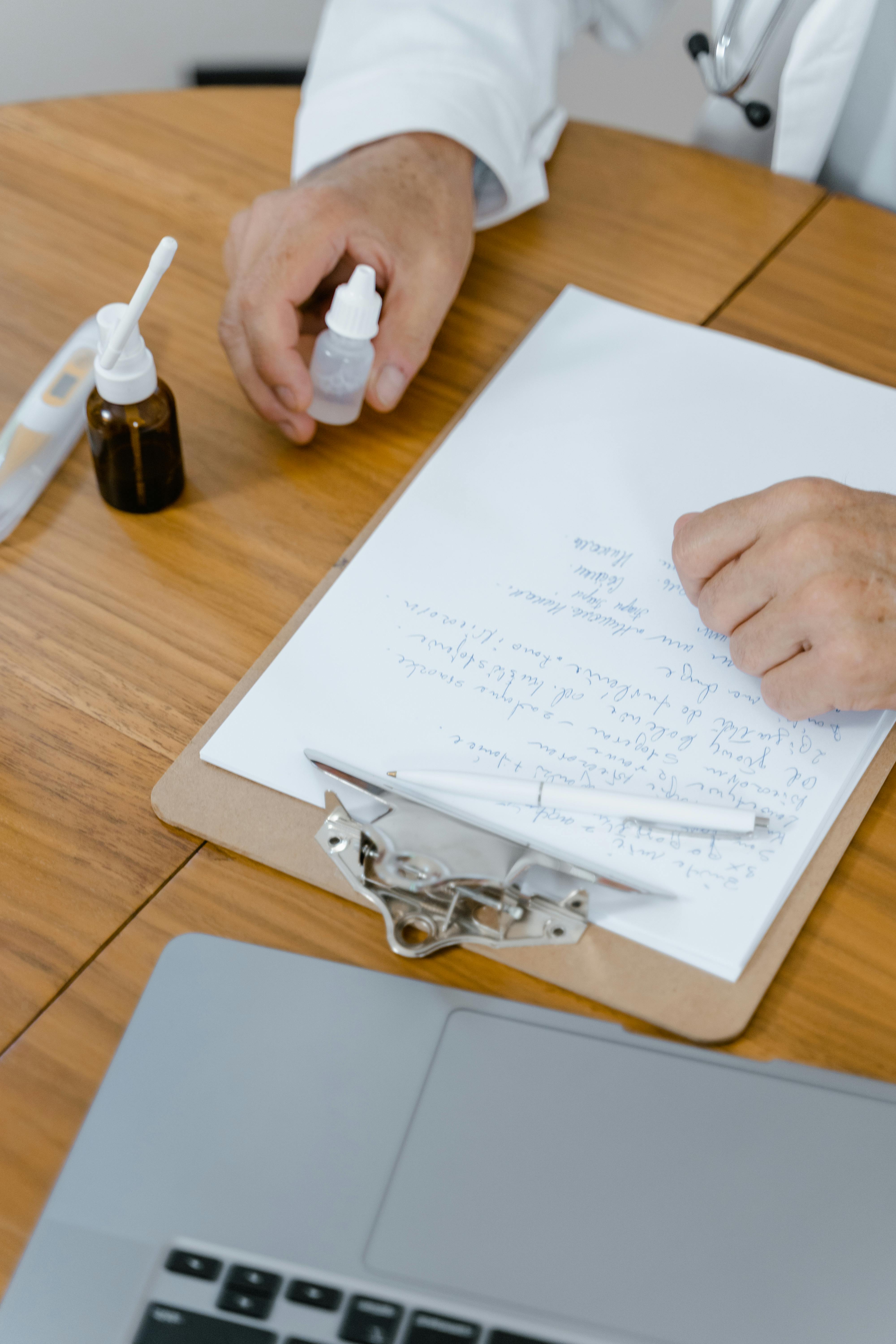 Photo Of Woman Writing On A Desk · Free Stock Photo