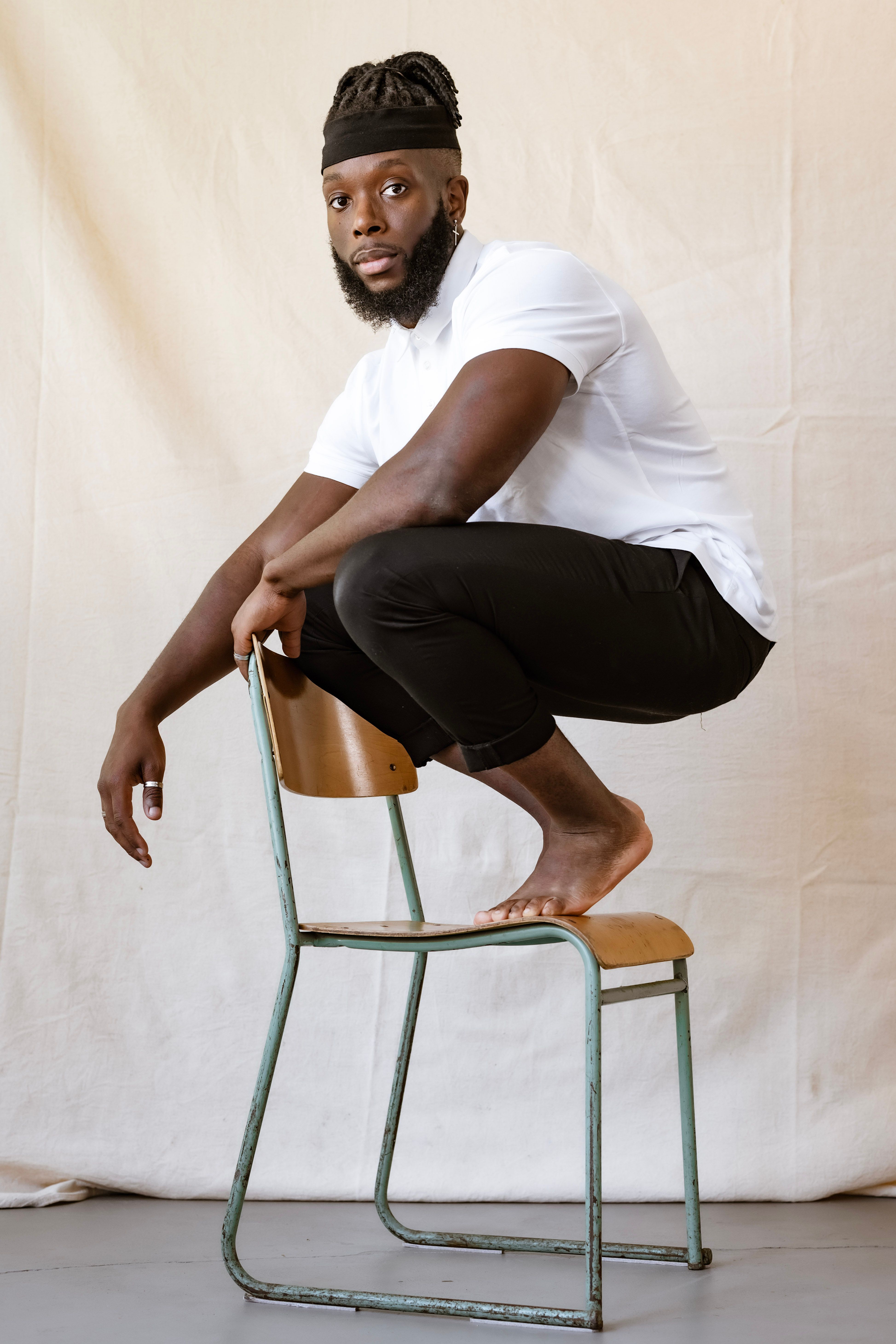 A Man in Black Pants Sitting on the Chair · Free Stock Photo