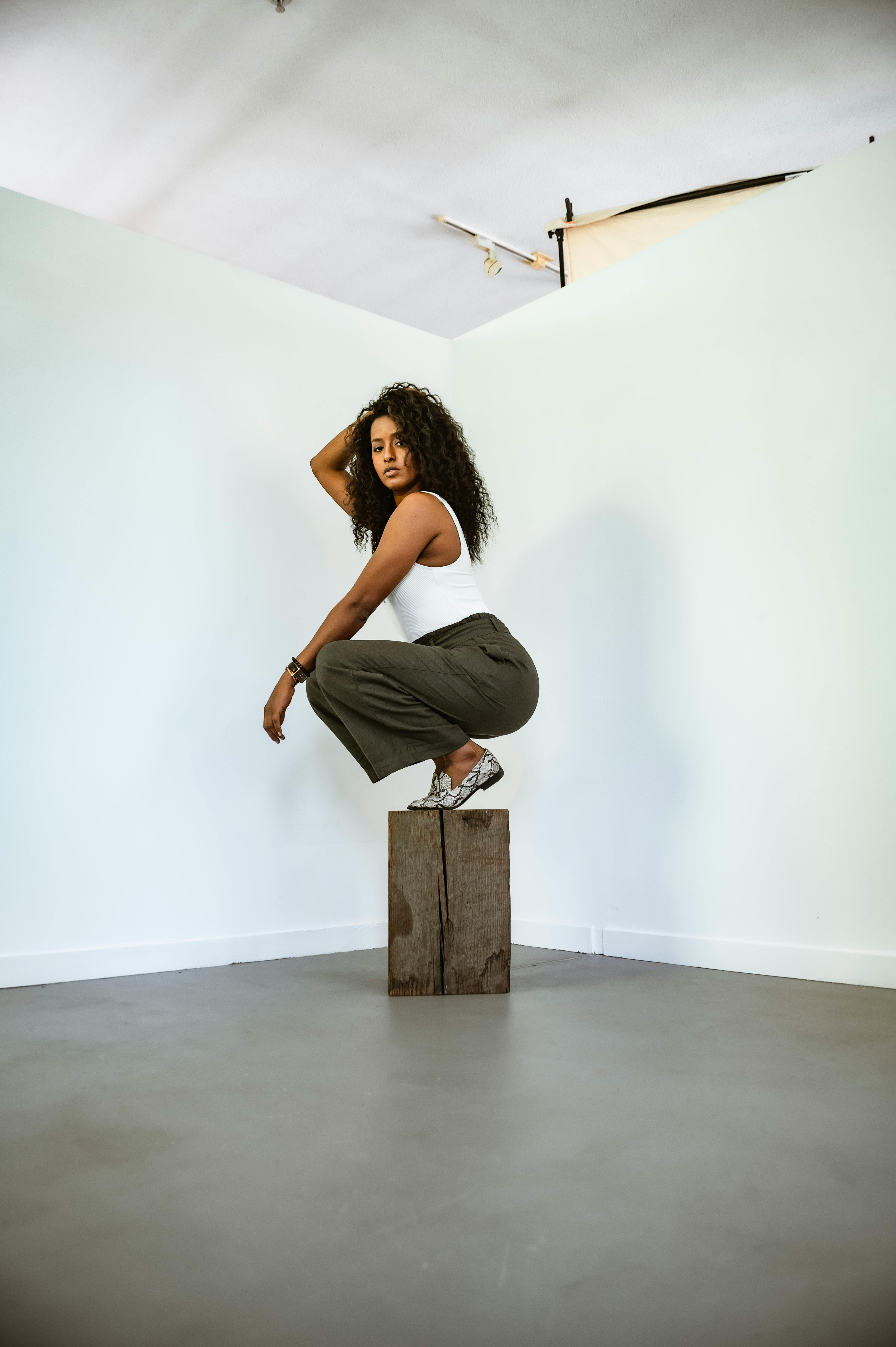 Empty Wooden Chair Near White Wall · Free Stock Photo