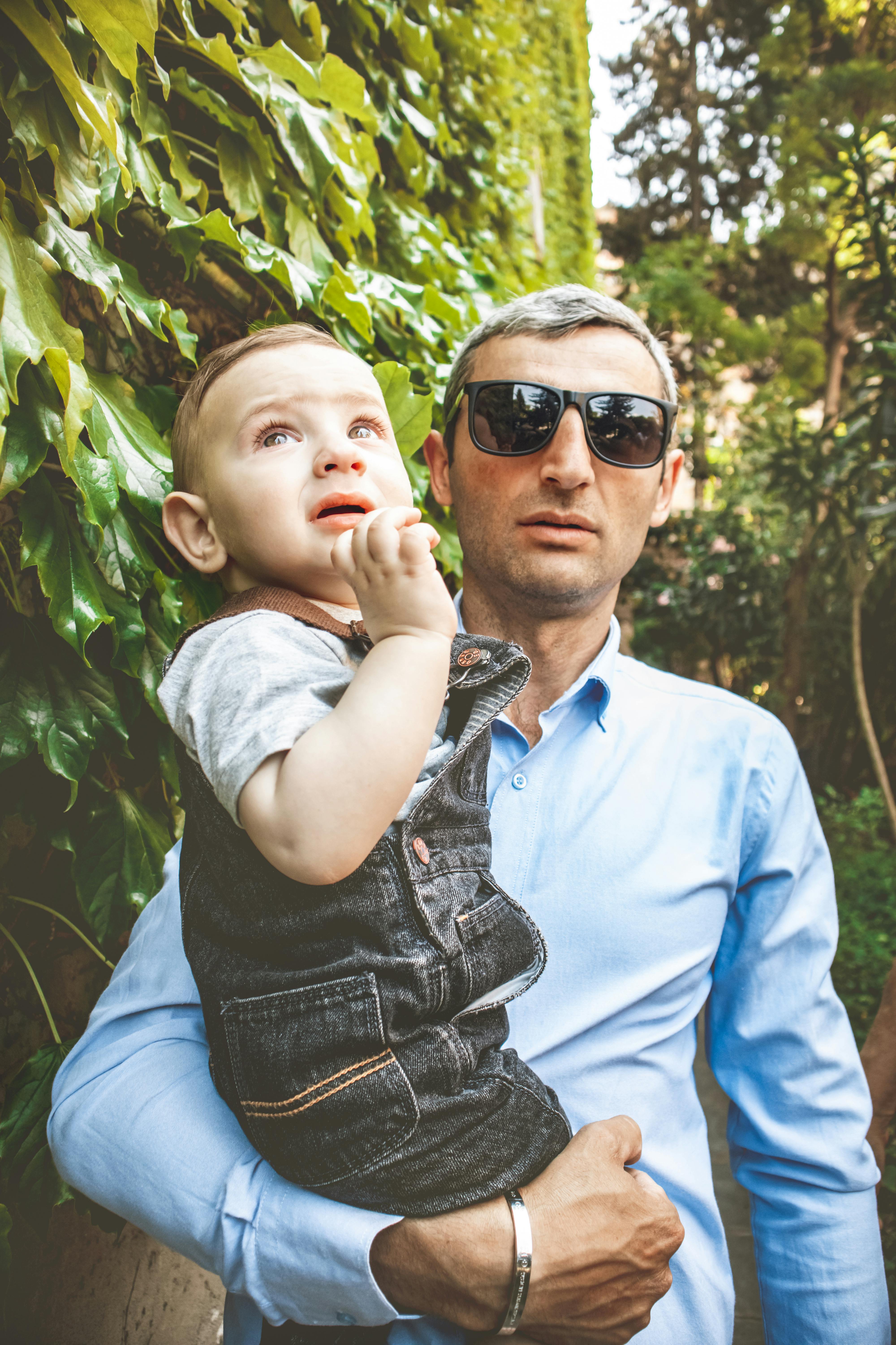 Man Carrying a Child · Free Stock Photo