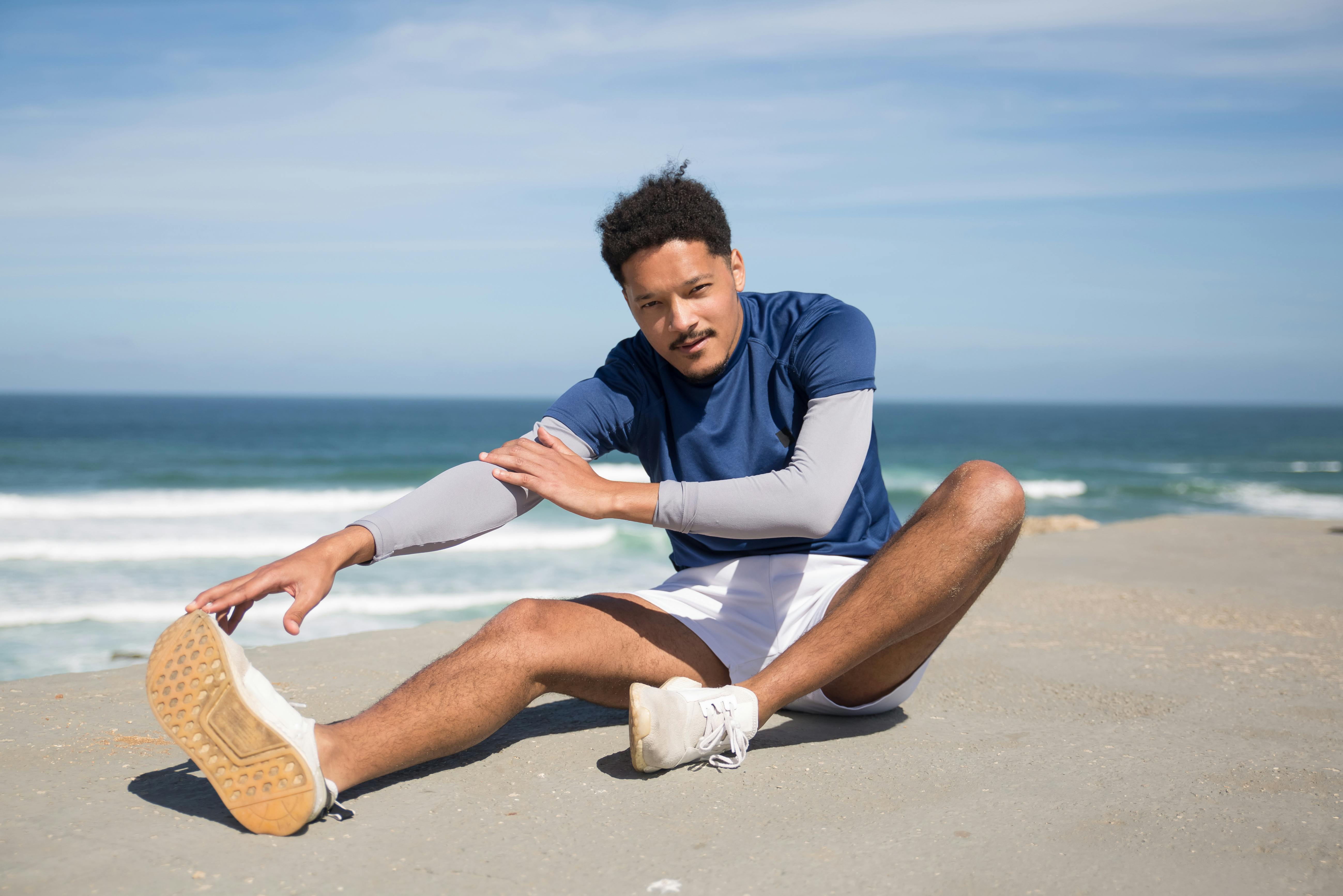 Photo of a Man Stretching · Free Stock Photo