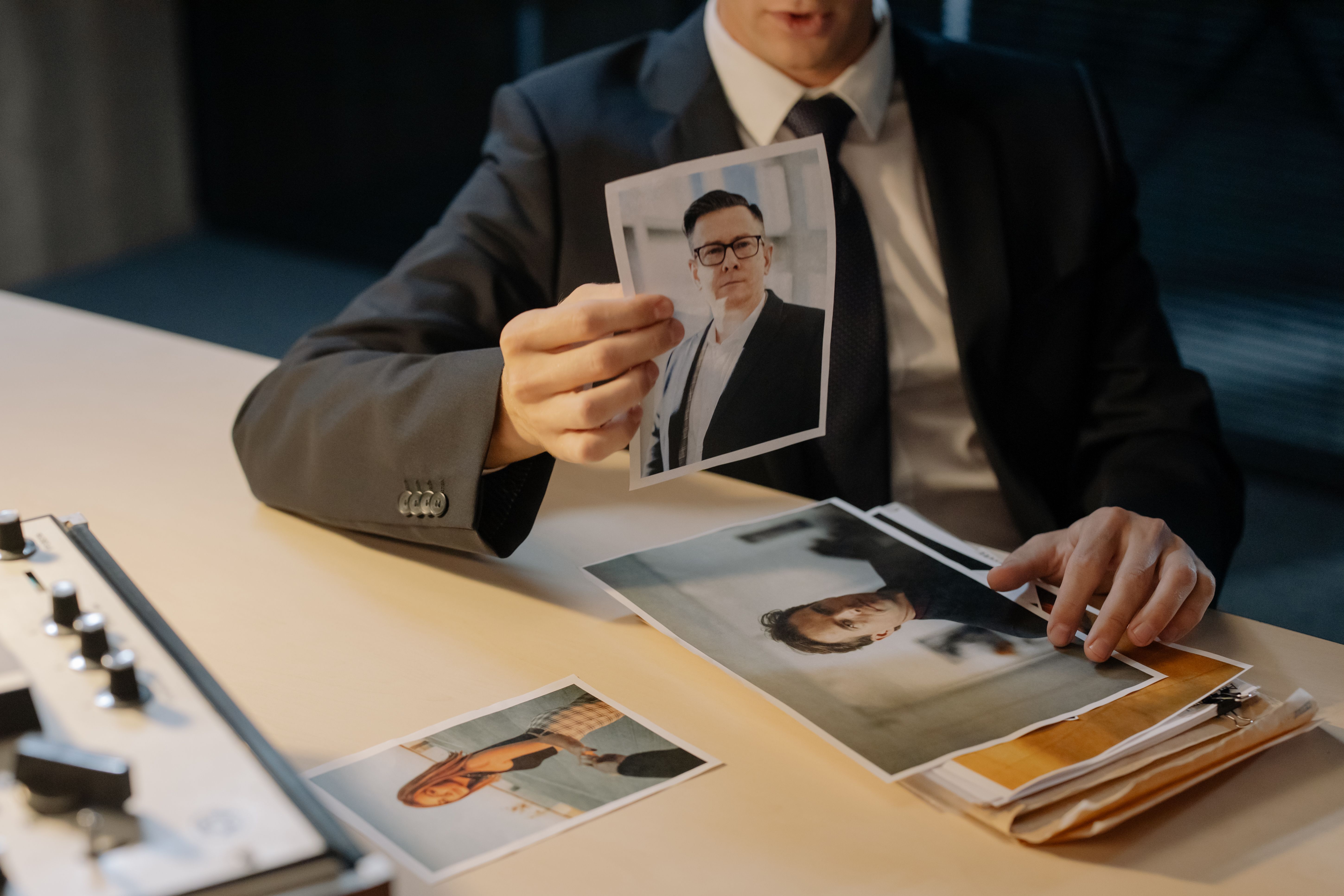 Photos of Evidence on the White Table · Free Stock Photo