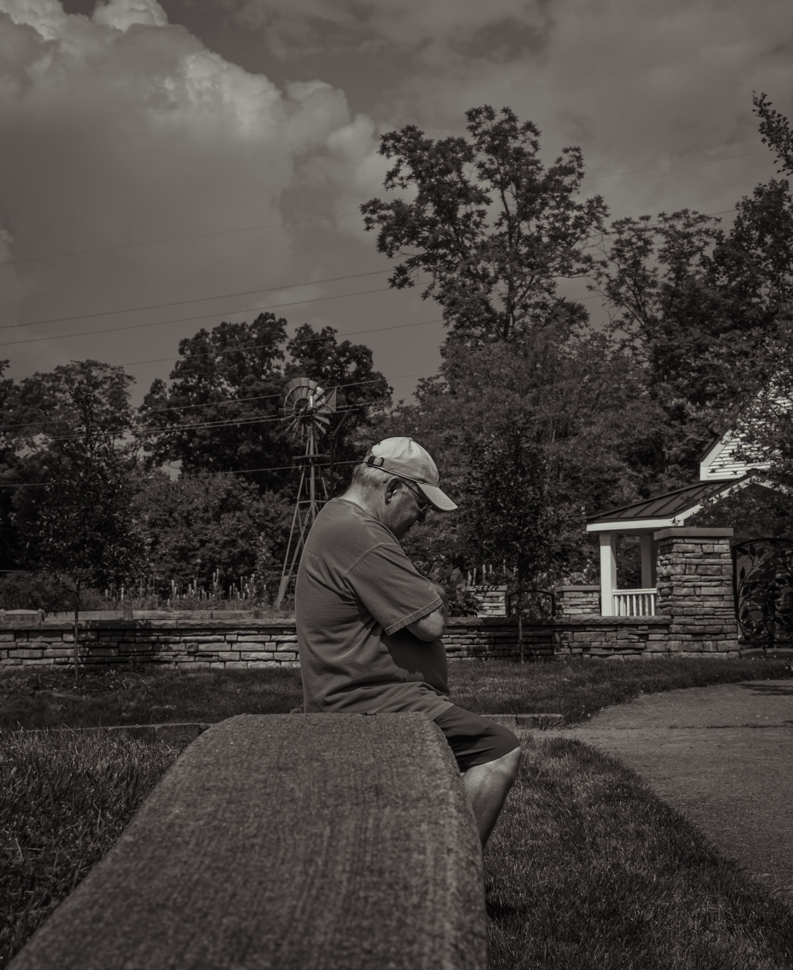 Man Lying on Bench in Yard · Free Stock Photo