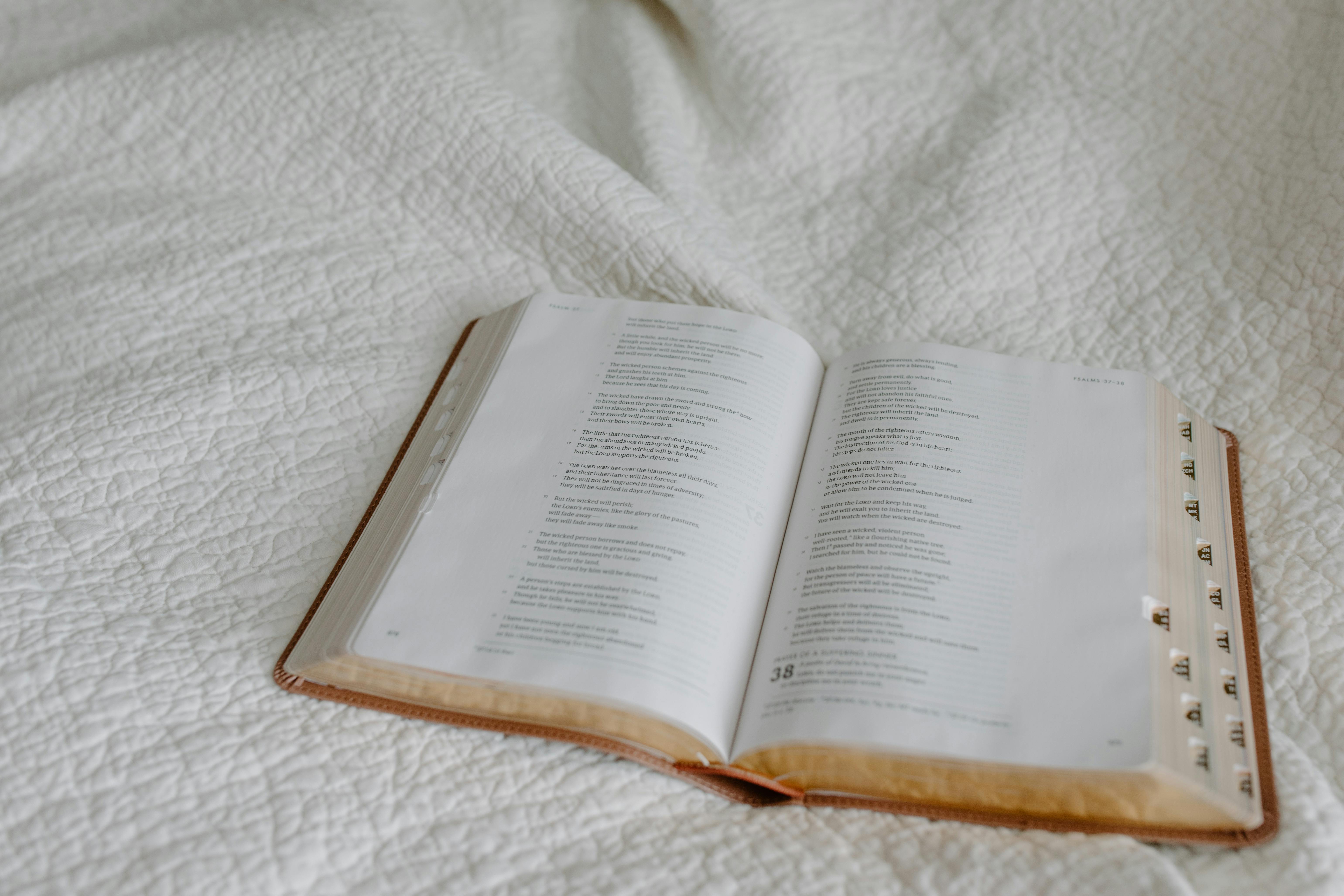 Open Book on White Linen · Free Stock Photo