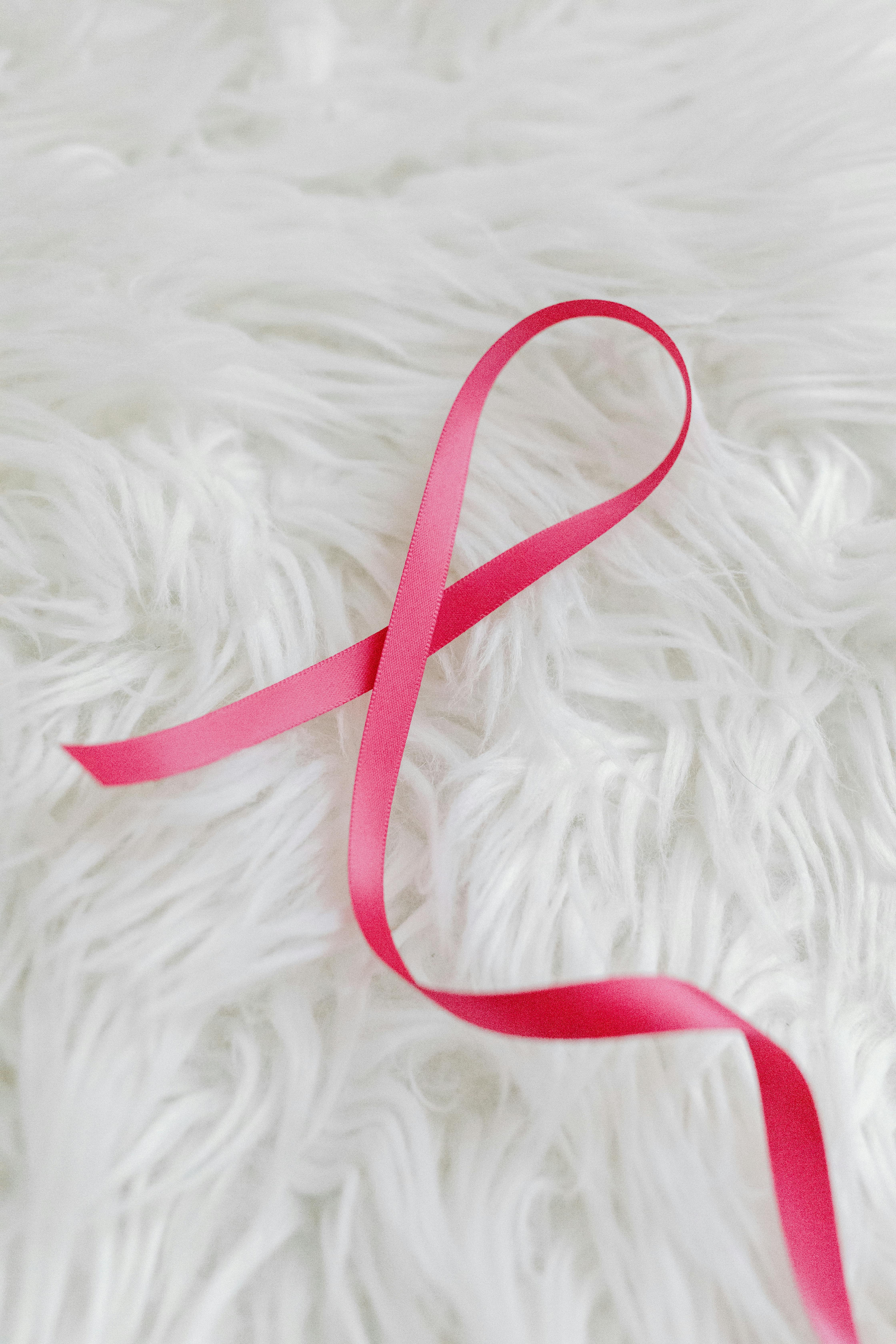 Pink Ribbon on Furry Surface · Free Stock Photo