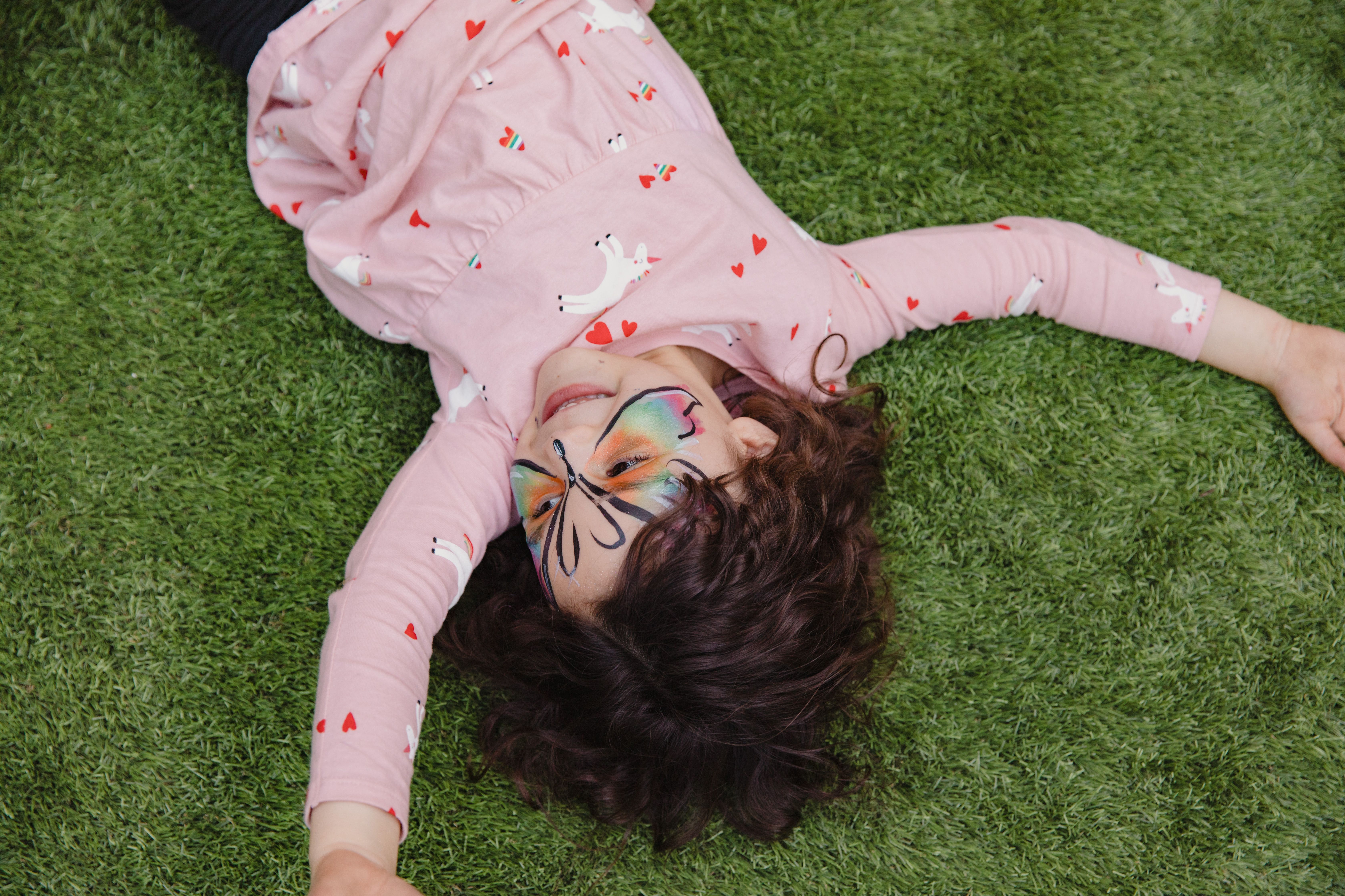Overhead Shot of a Girl with Face Paint · Free Stock Photo
