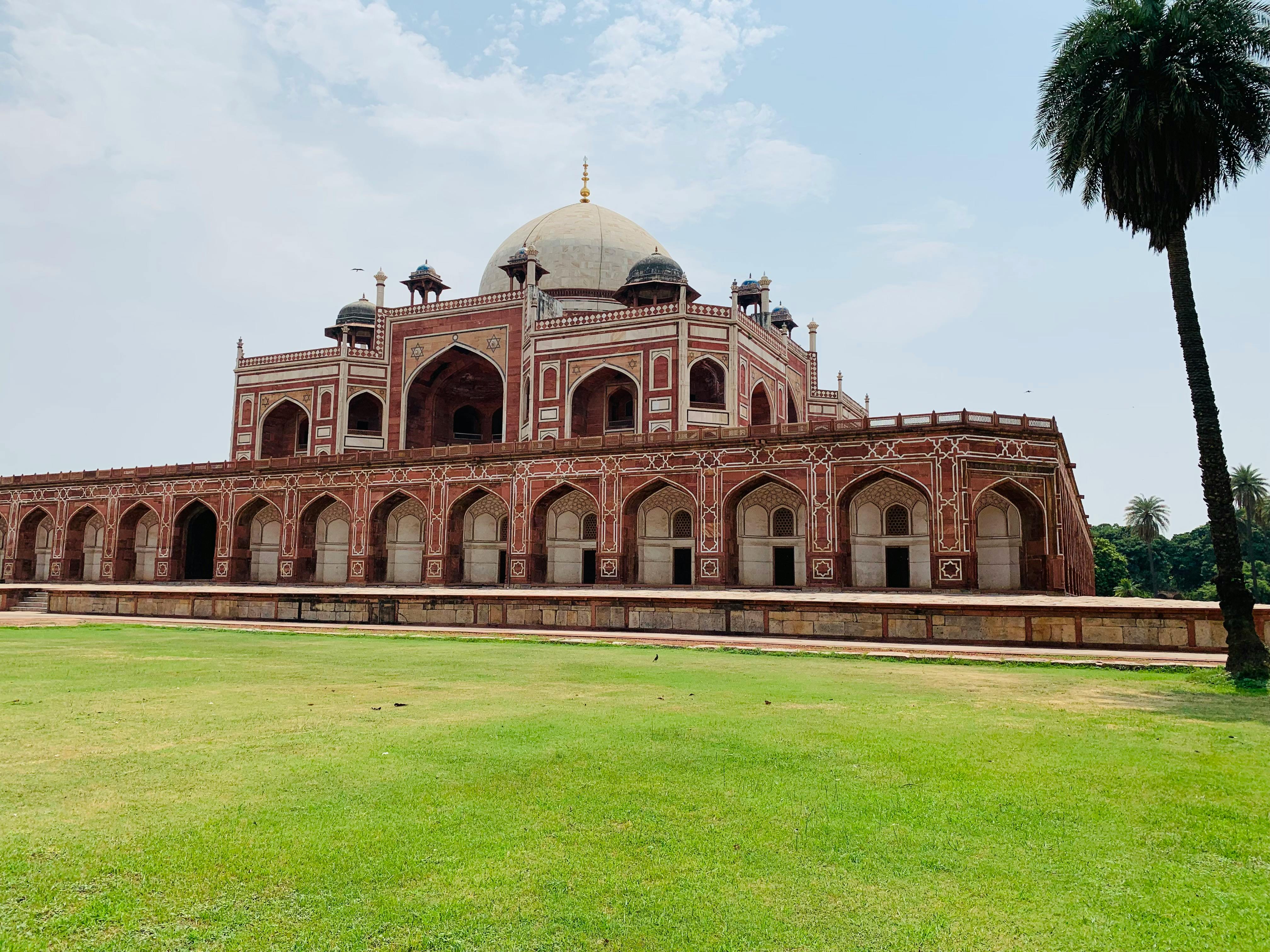 Brown and Black Mosque Under White and Blue Cloudy Sky · Free Stock Photo
