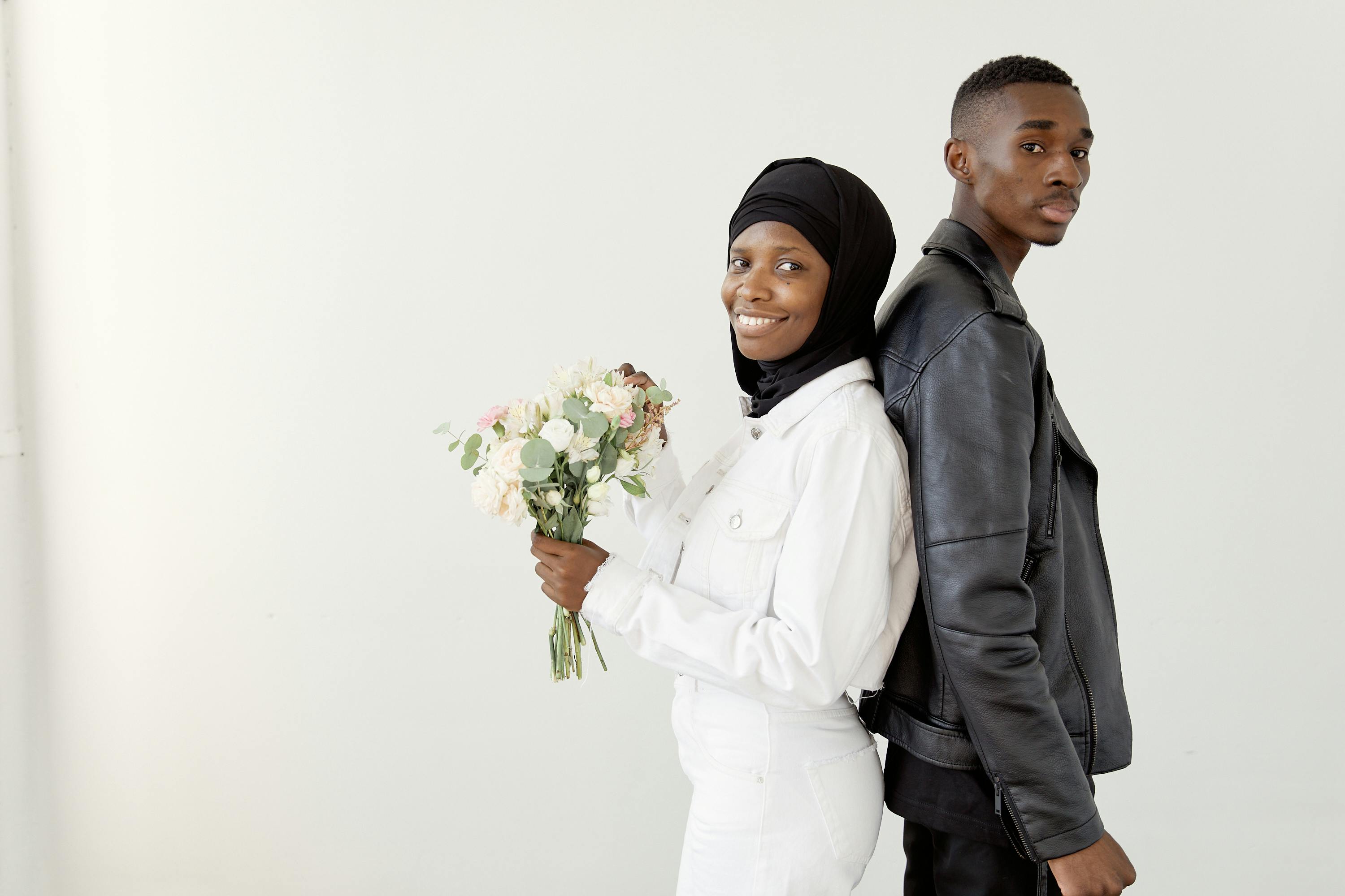 Couple Posing Back to Back · Free Stock Photo