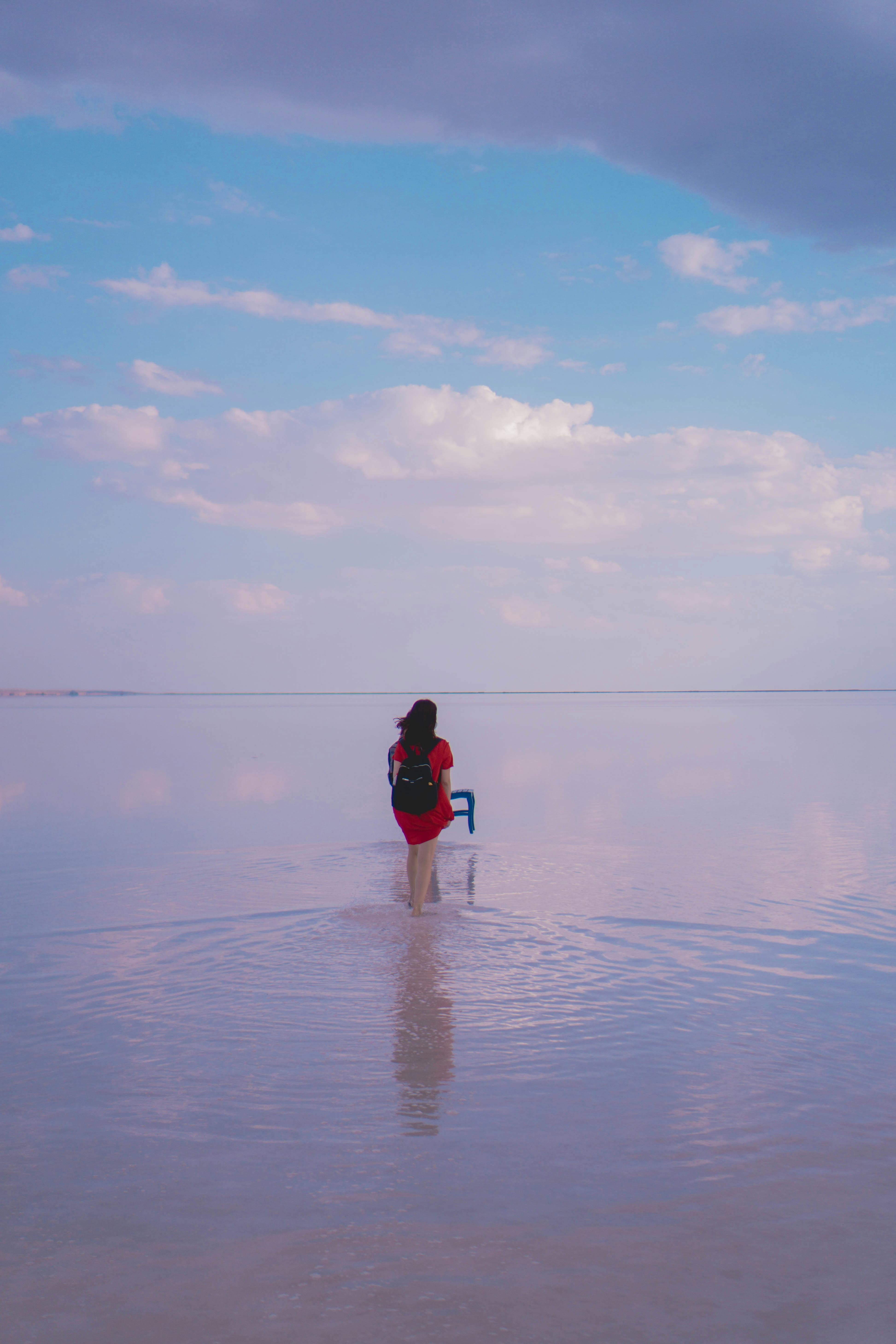 Woman Walking in Water · Free Stock Photo