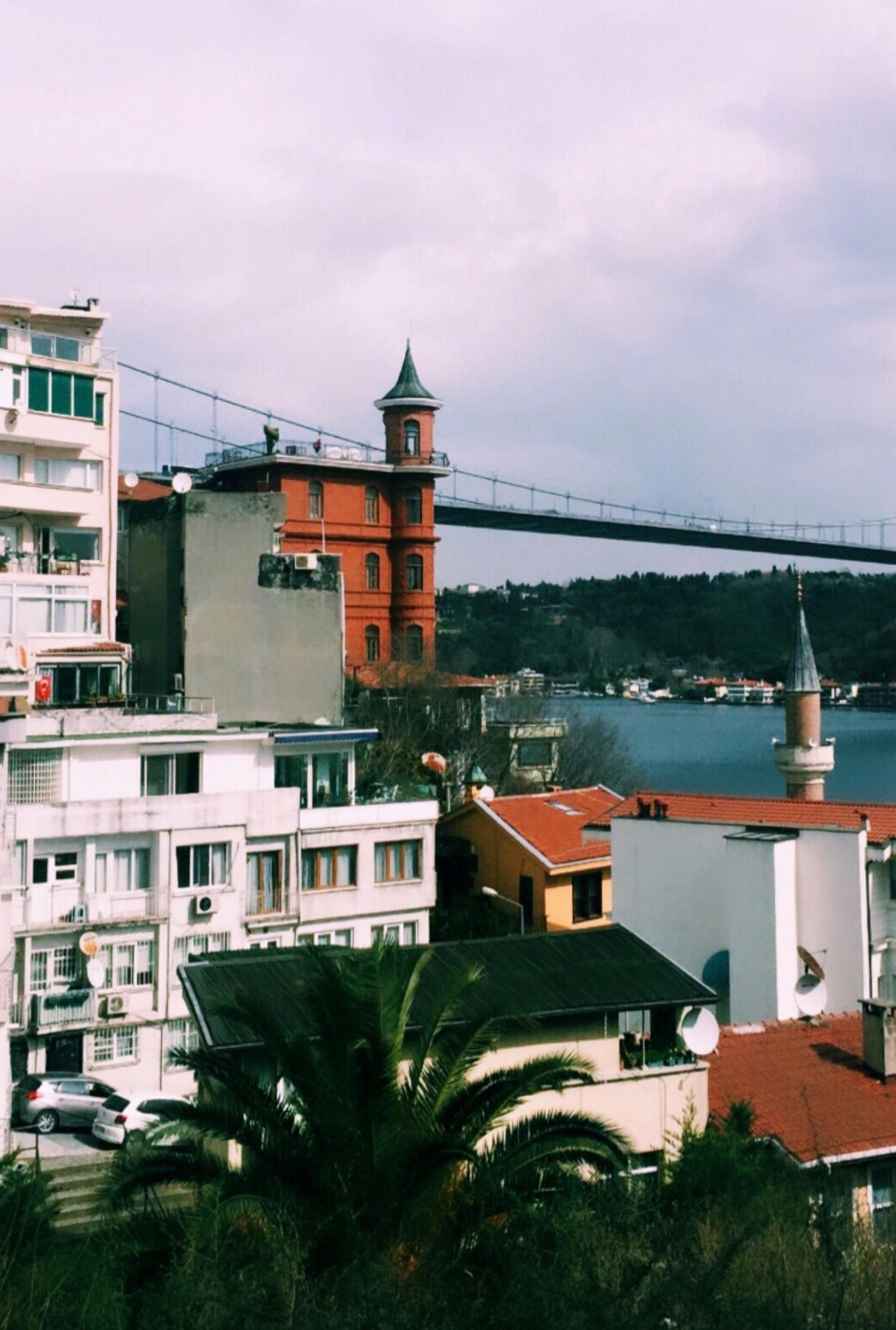 Brown Concrete Building Near River · Free Stock Photo